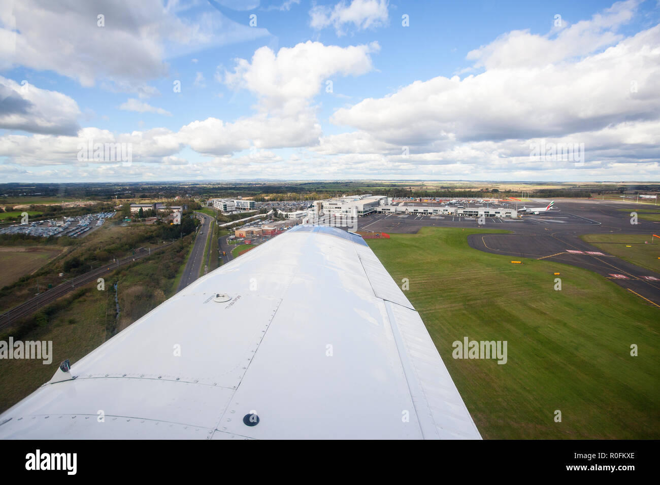 View of Newcastle Airport over the wing out of a Piper PA-28 Cherokee ...