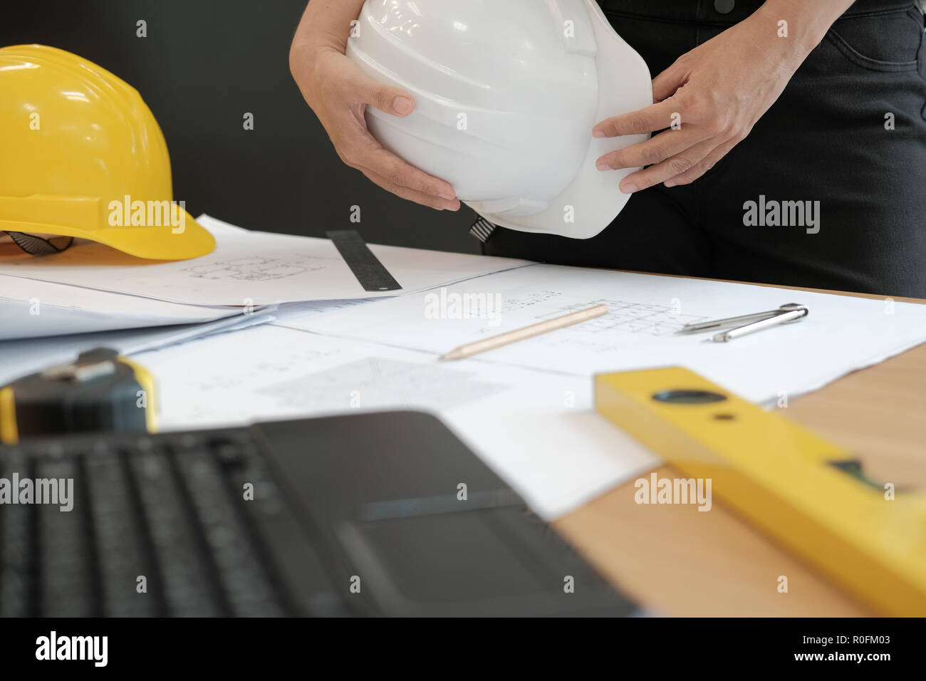 engineer architect worker holding safety helmet hardhat wtih ...