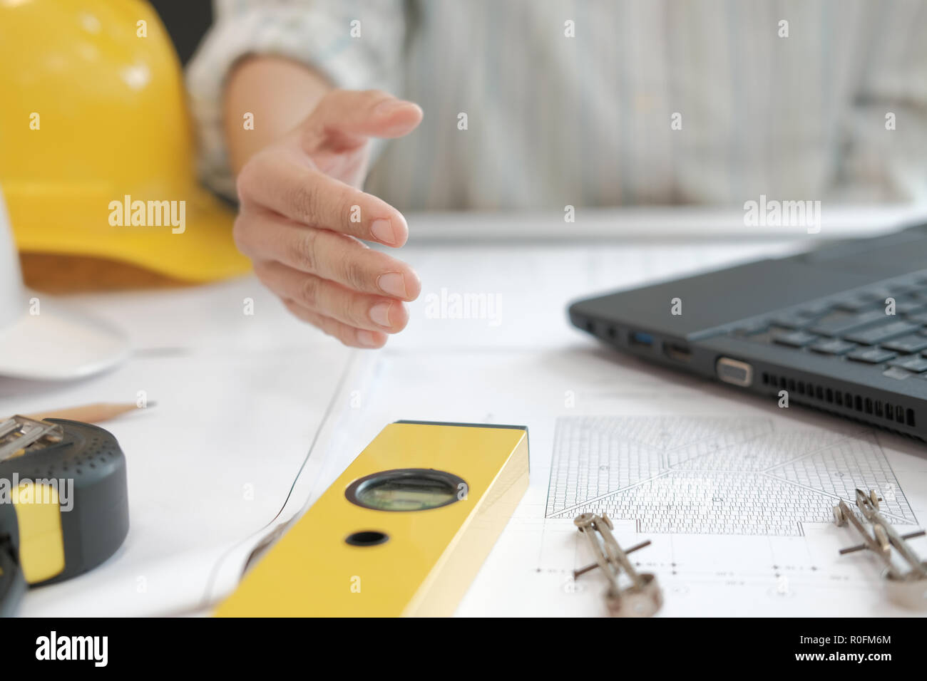 engineer offering handshake. architect ready to shake hand for building ...
