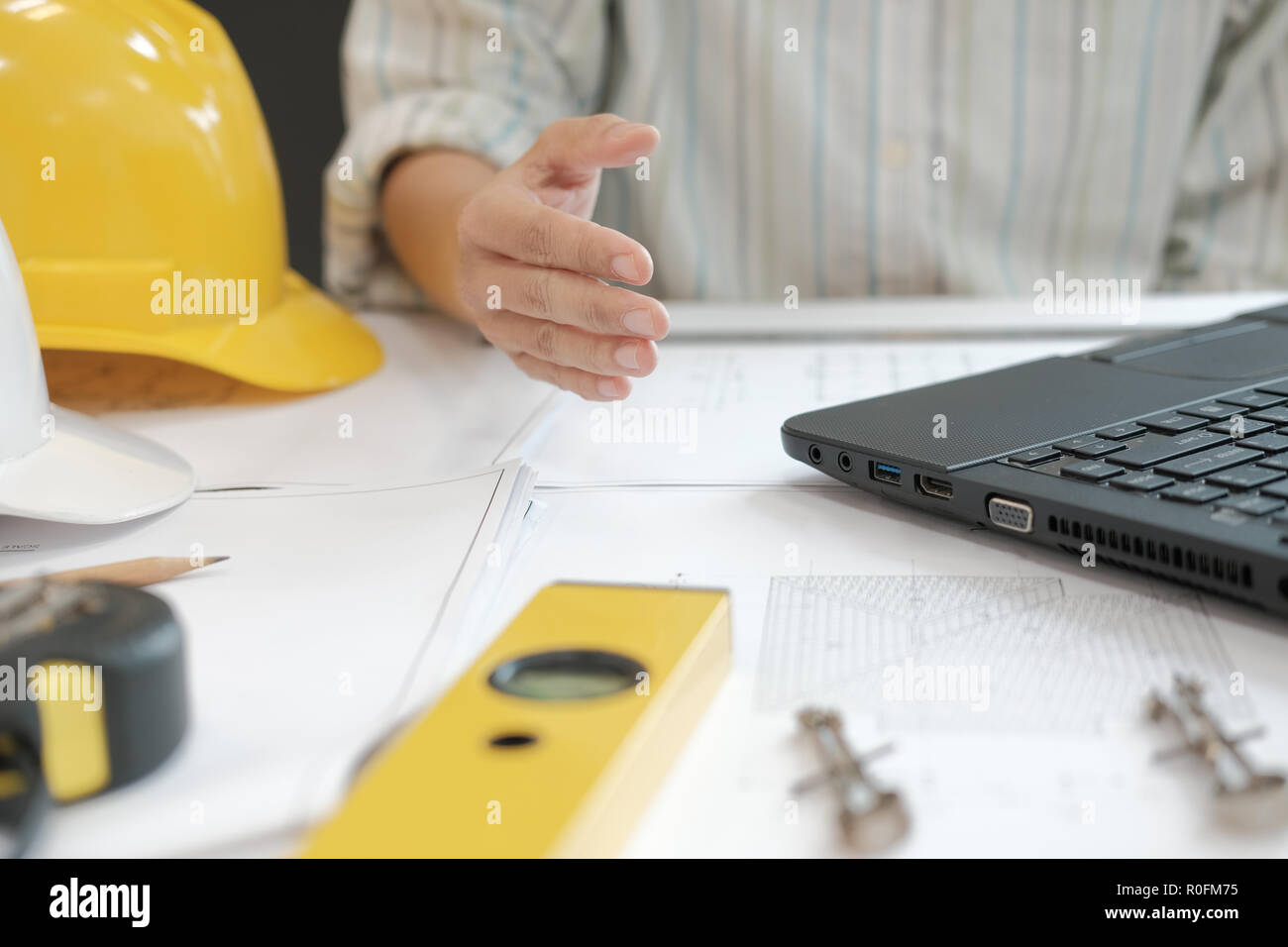 engineer offering handshake. architect ready to shake hand for building ...