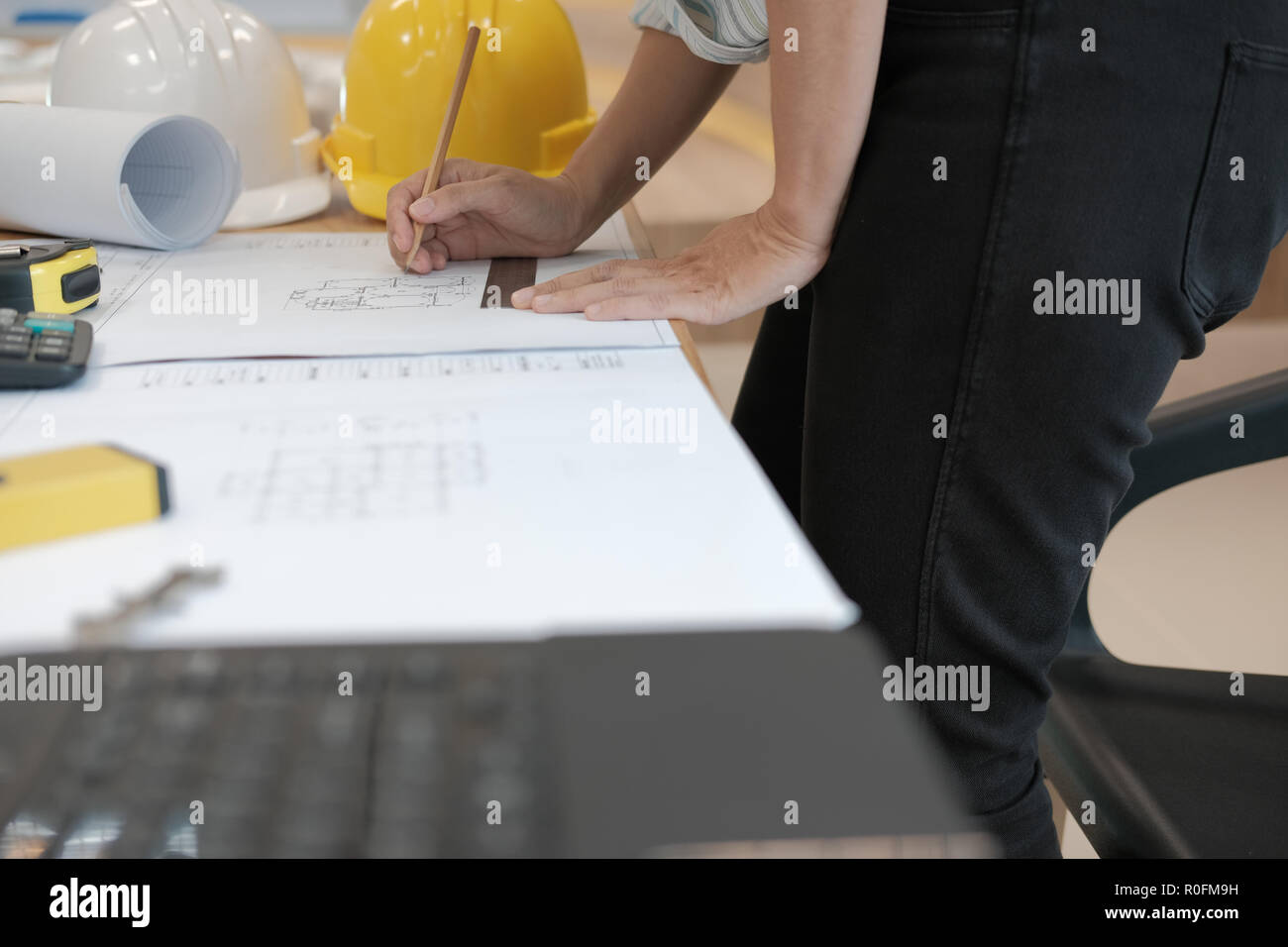 architect engineer working on house blueprint of real estate project at ...