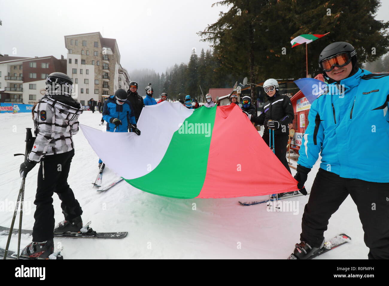 Skiing with Bulgarian flags at Pamporovo ski resort, Bulgaria. People ...