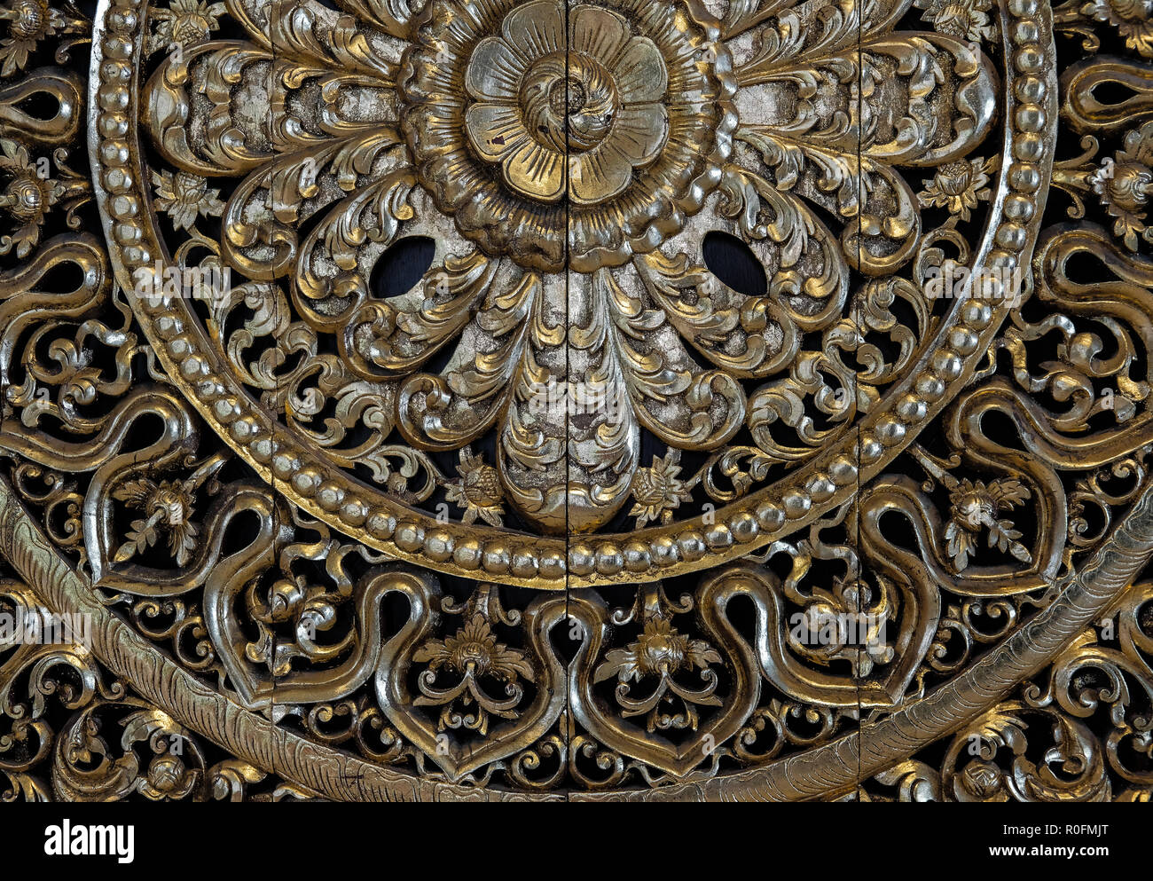 carved golden flower carving sculpture pattern art on wall Stock Photo ...