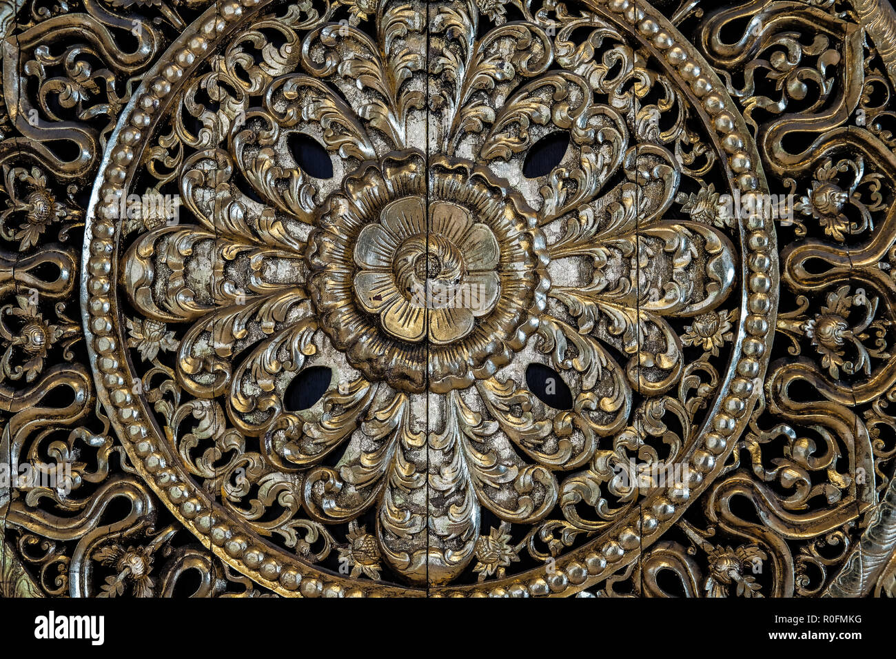 carved golden flower carving sculpture pattern art on wall Stock Photo ...