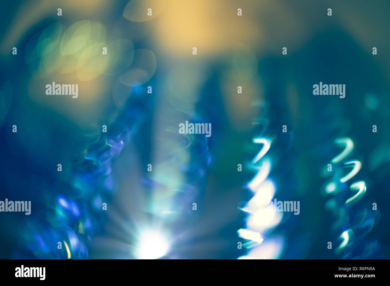 Christmas background with shining lights and flares in purple and blue ...
