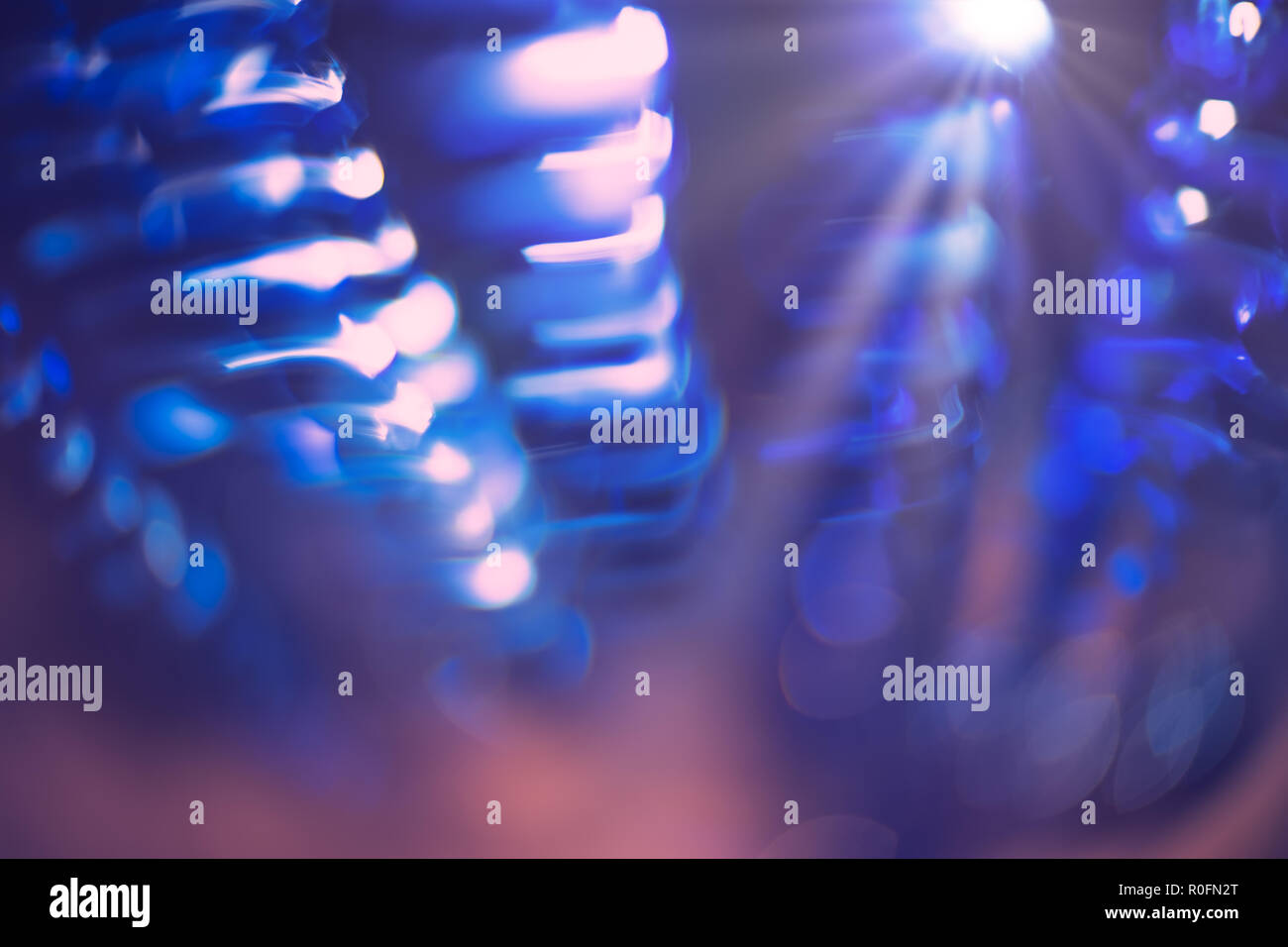 Abstract background of multi-colored glowing lights of blue Christmas ...