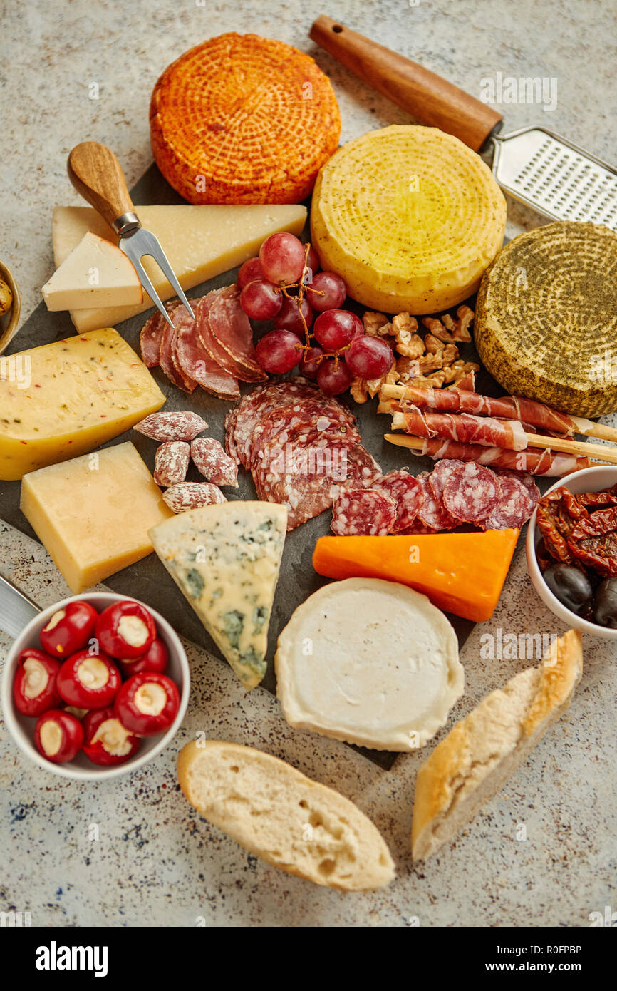 Delicious mix of different snacks and appetizers Stock Photo - Alamy