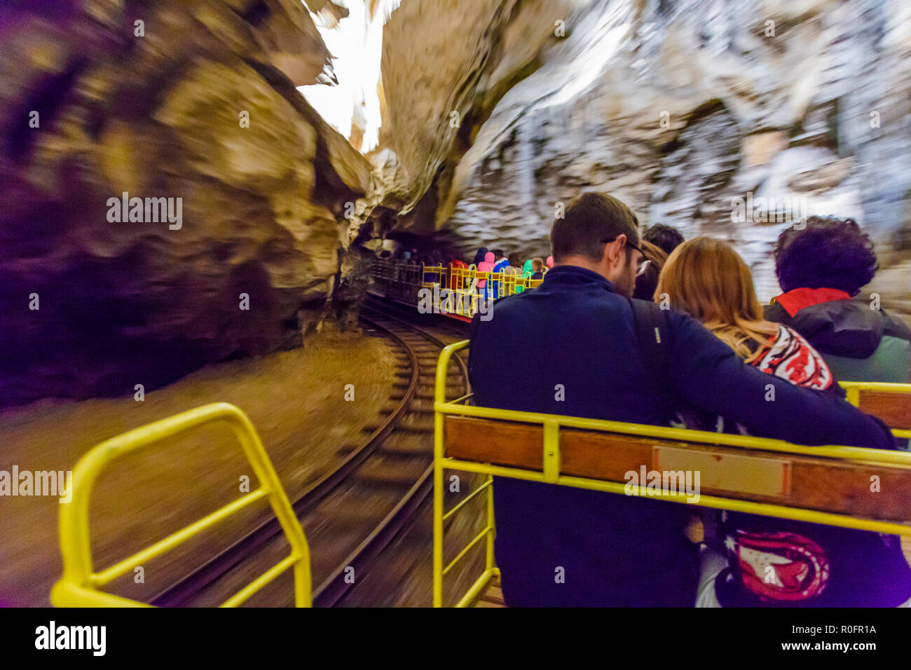 Cave train and people Stock Photo - Alamy