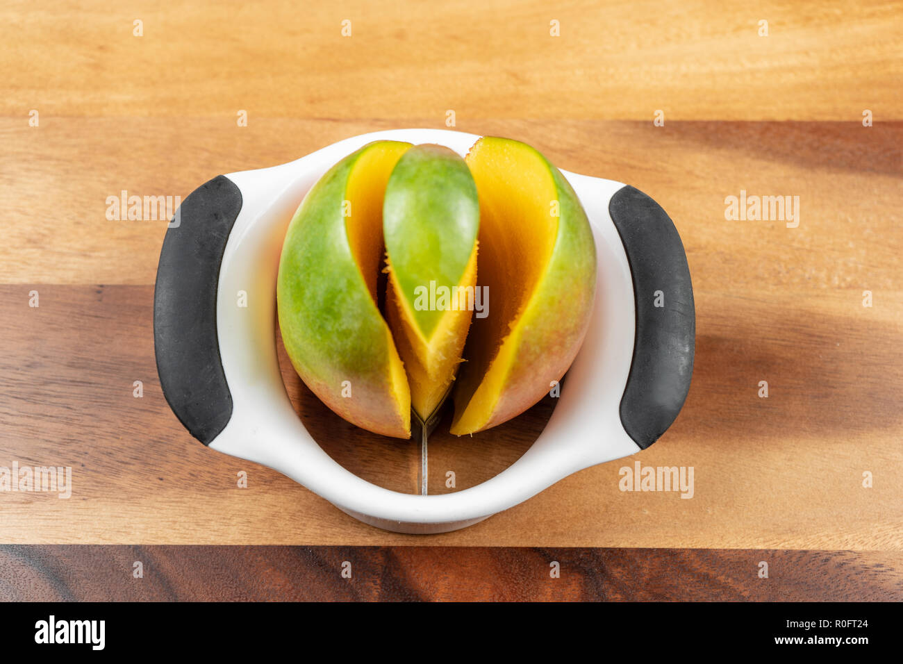 The Mango Splitter slices cleanly through the fruit and leaves almost ...