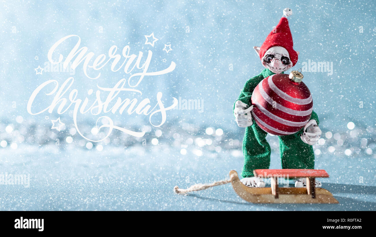 Cute Cheerful Santas Helper Elf Loading Christmas Bauble Onto Santas ...