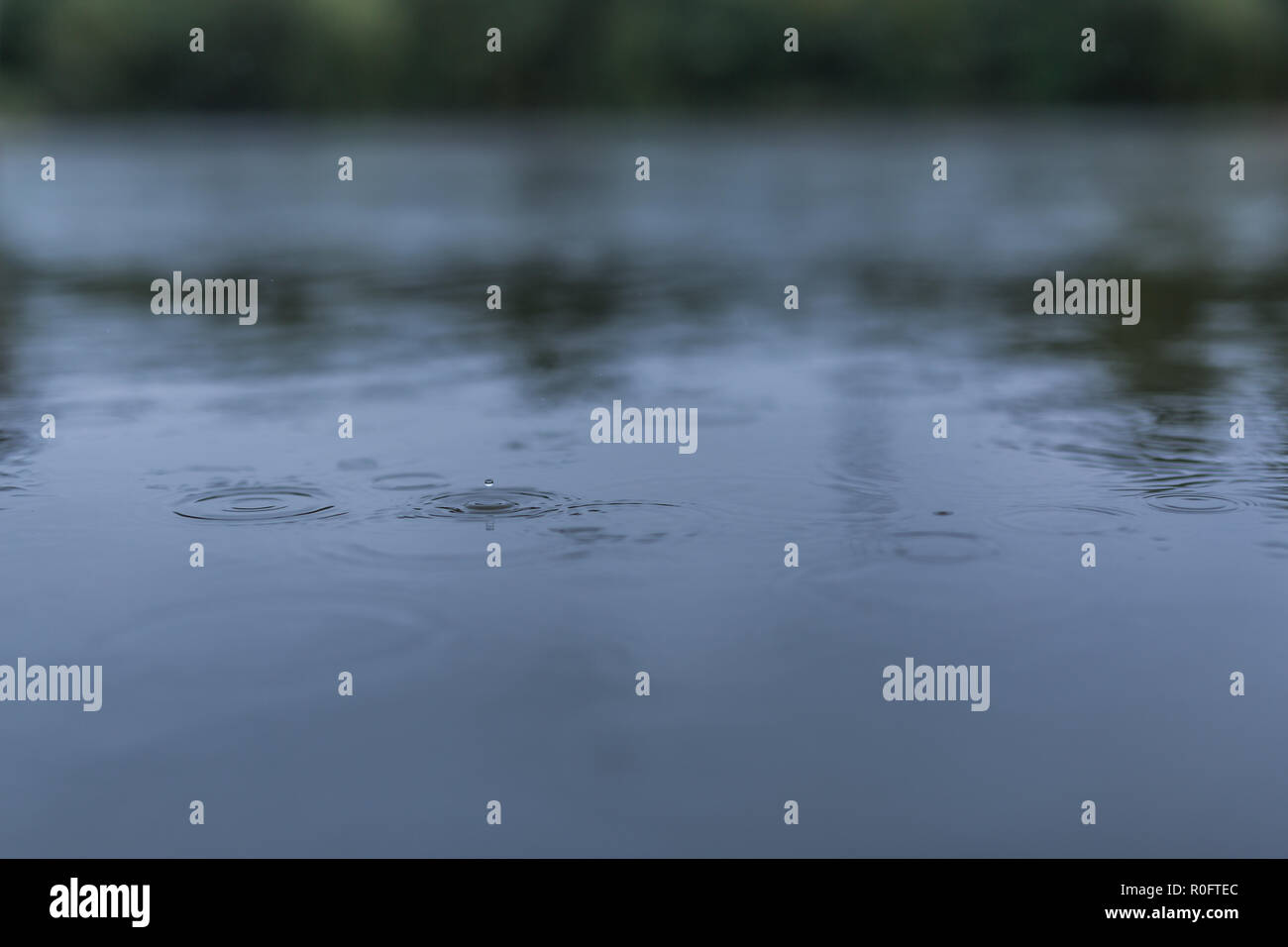 Rain drops falling puddle in hi-res stock photography and images - Alamy