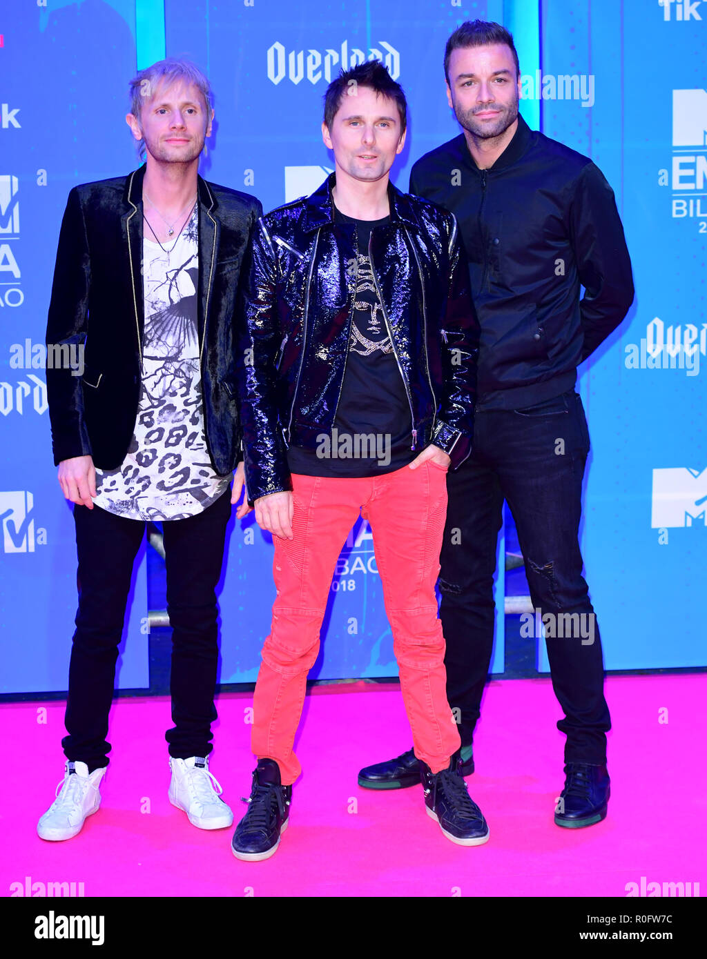 Dominic Howard, Matt Bellamy and Chris Wolstenholme of Muse attending ...