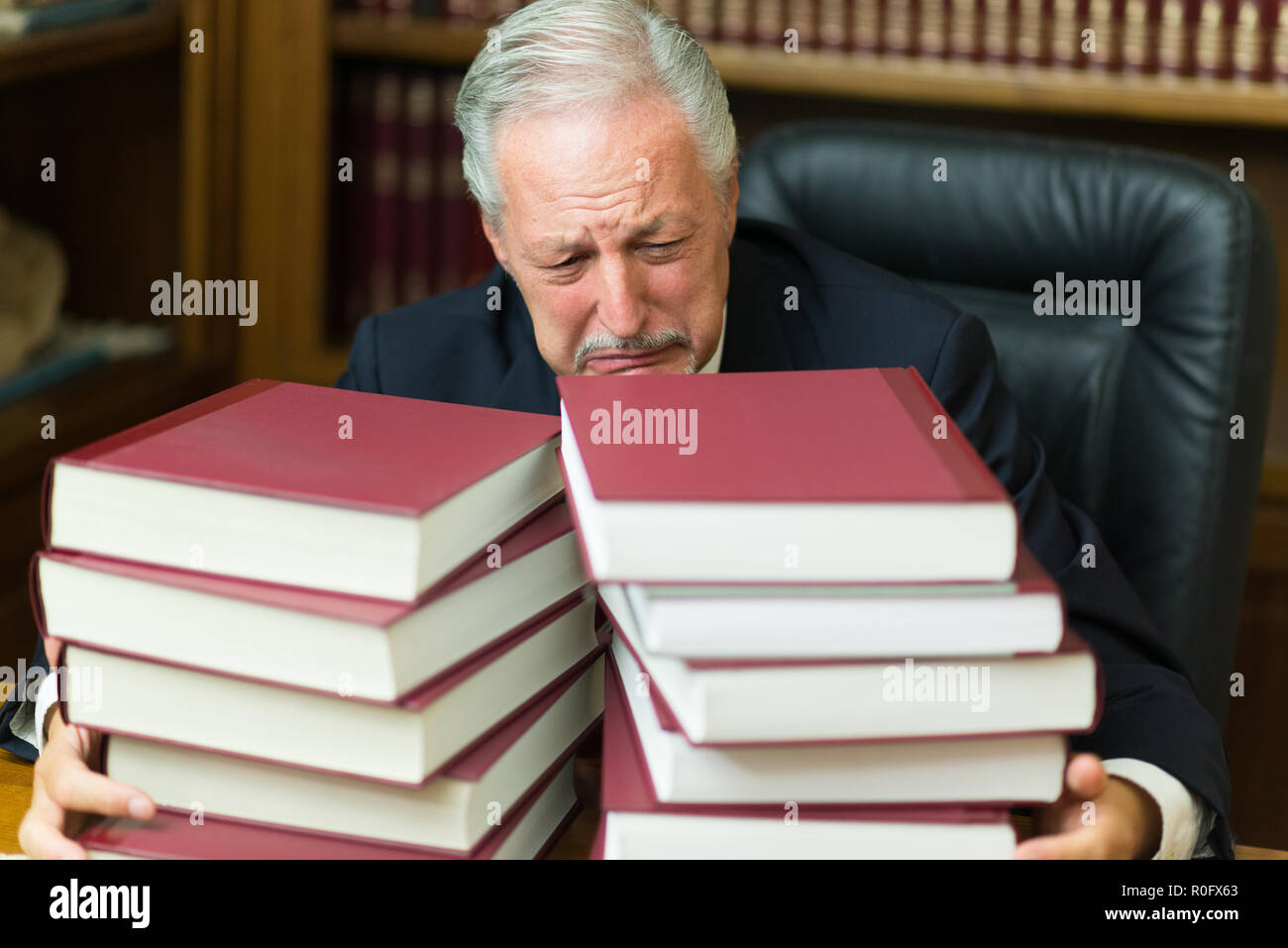 Surrounded by books hi-res stock photography and images - Alamy