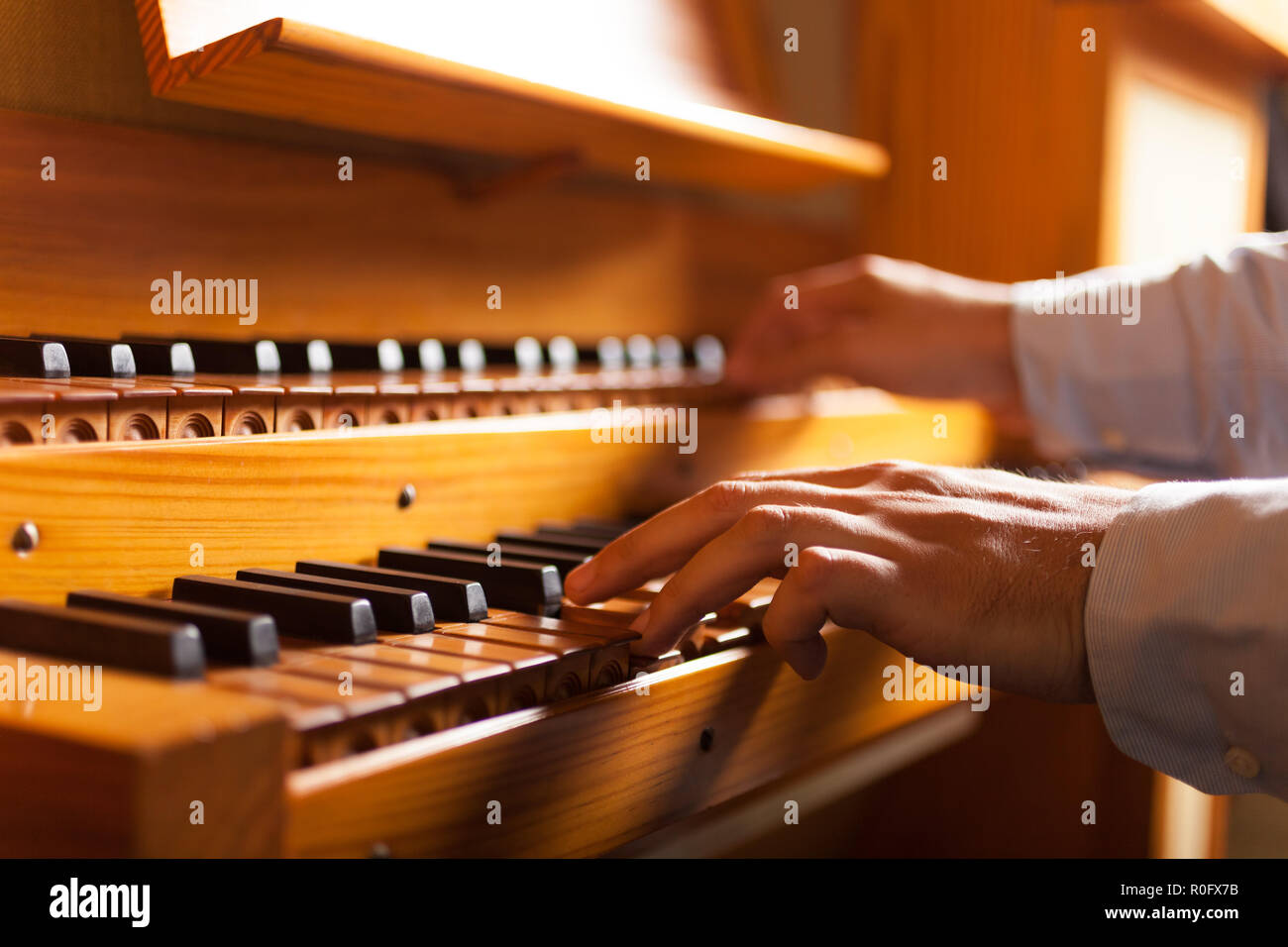 Detail of a man playing an organ Stock Photo - Alamy