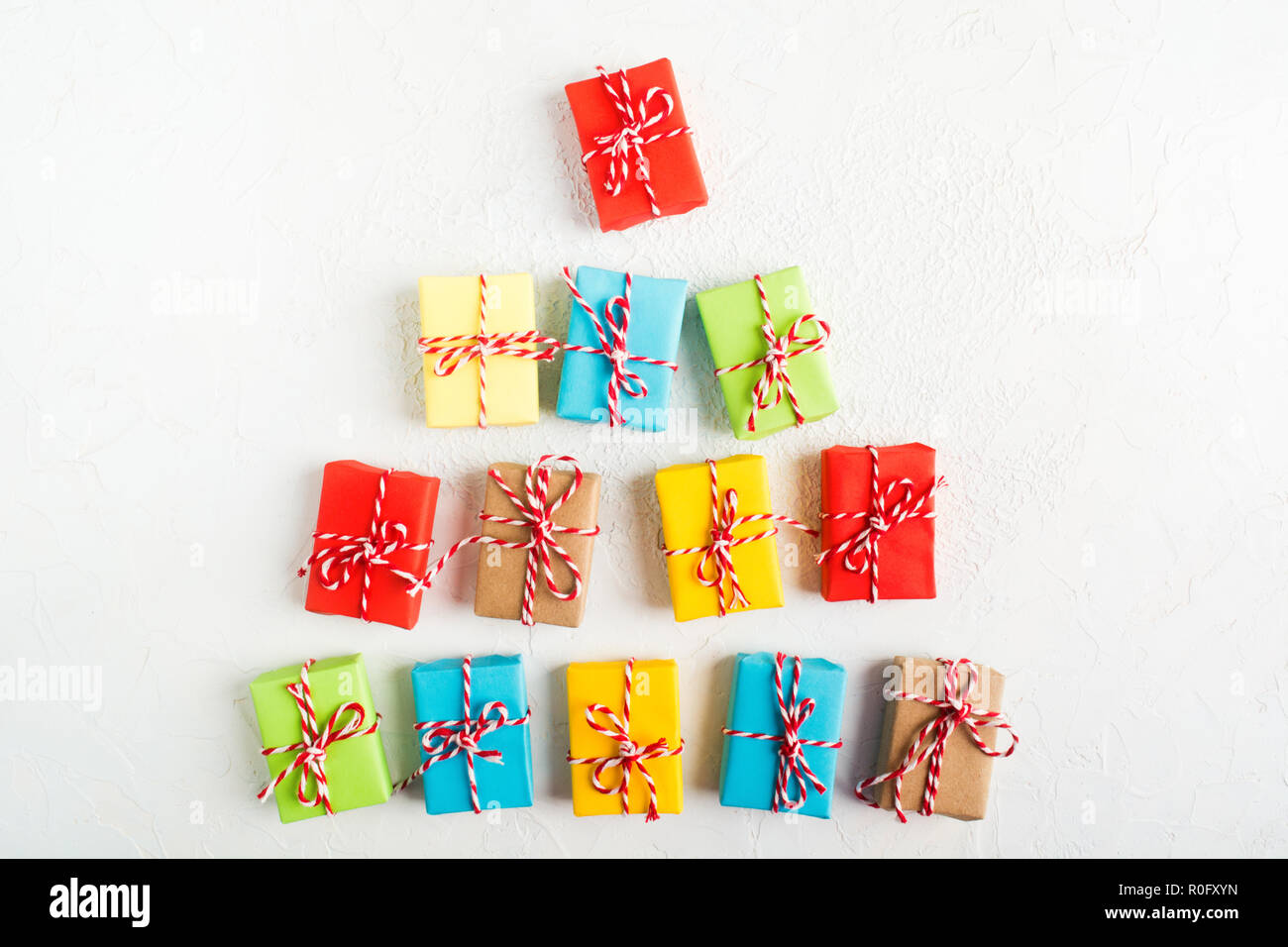 Christmas tree of colorful gift boxes on white background, flat lay ...