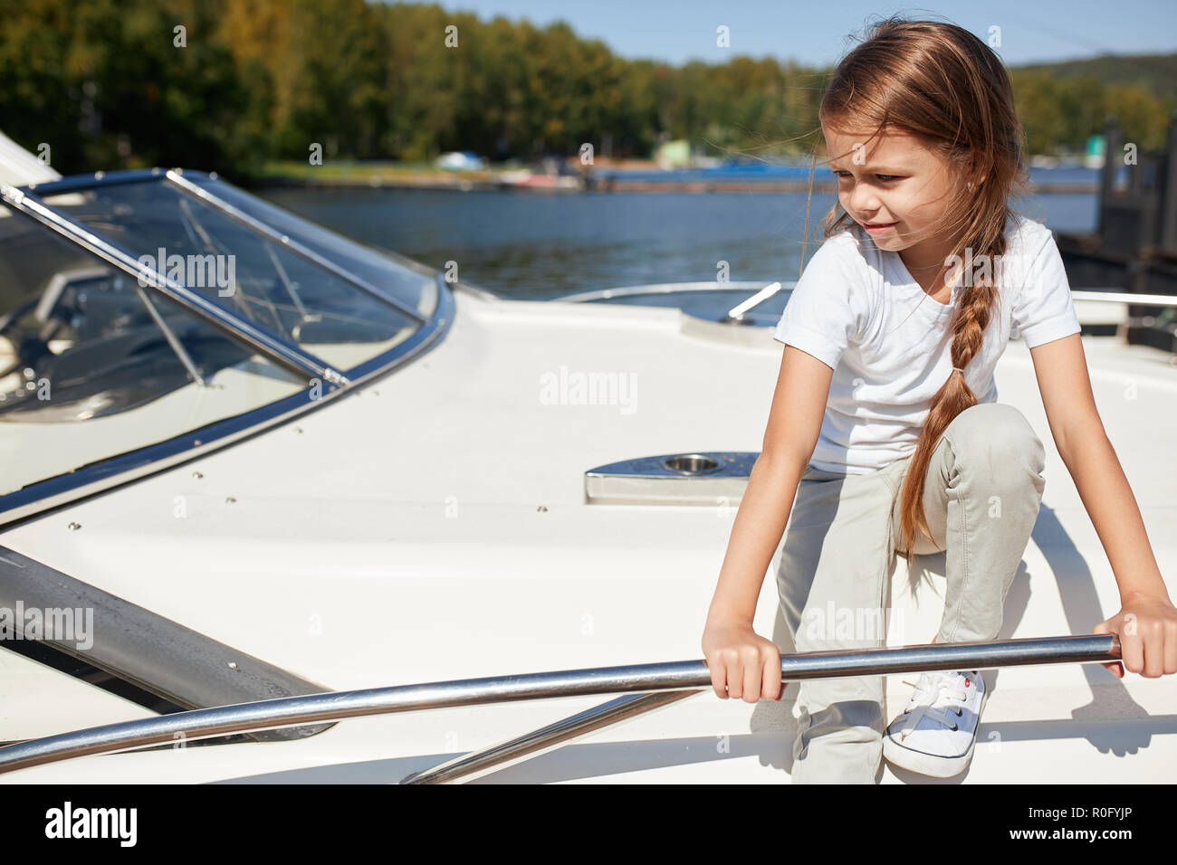 Girl sitting on front boat hi-res stock photography and images - Alamy
