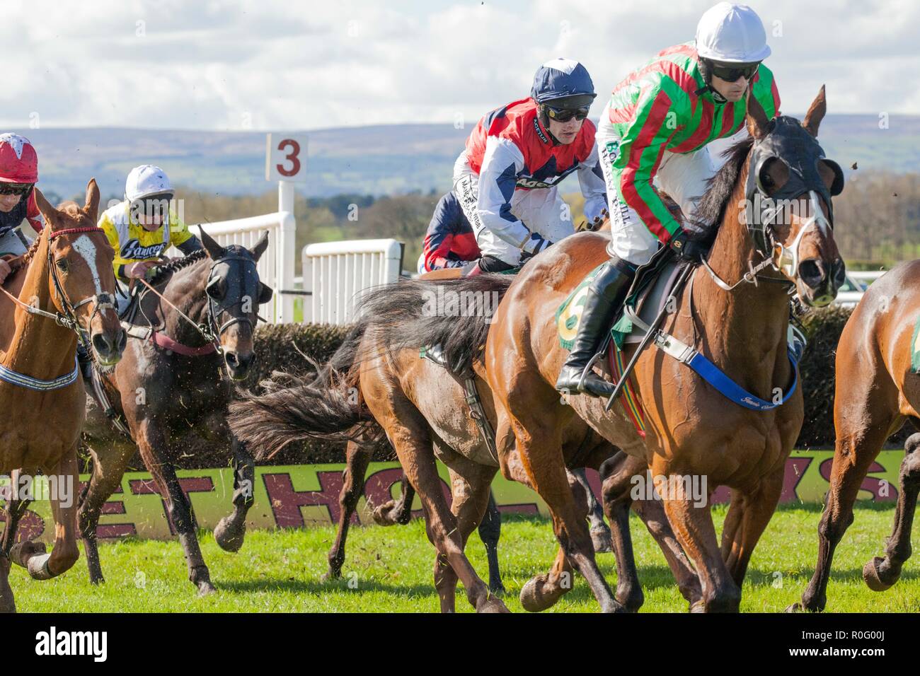 Jockeys competing in national hunt horse racing at Bangor on Dee ...
