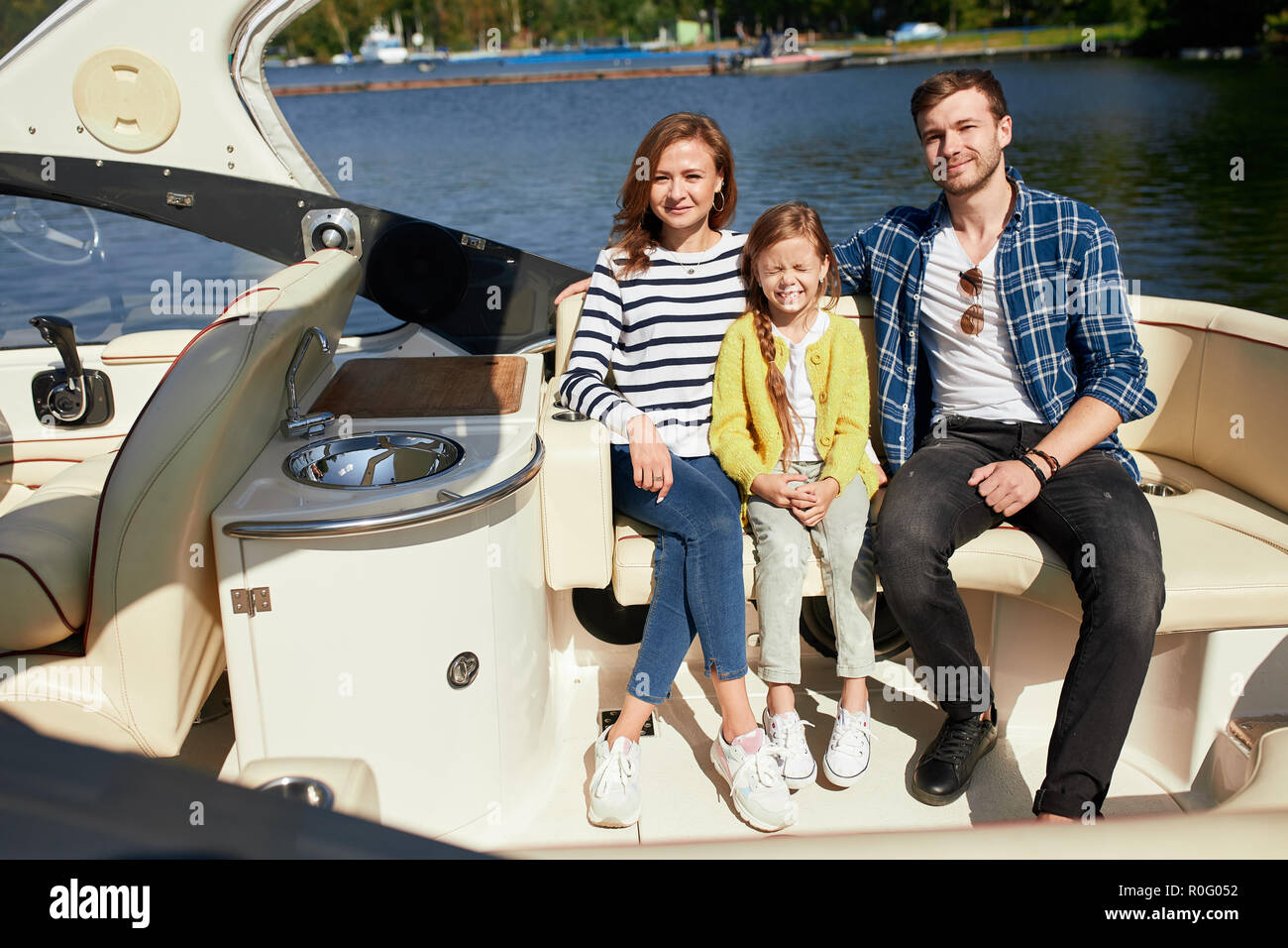 happy family with daughter on sailing boat at sunny autumn day Stock ...