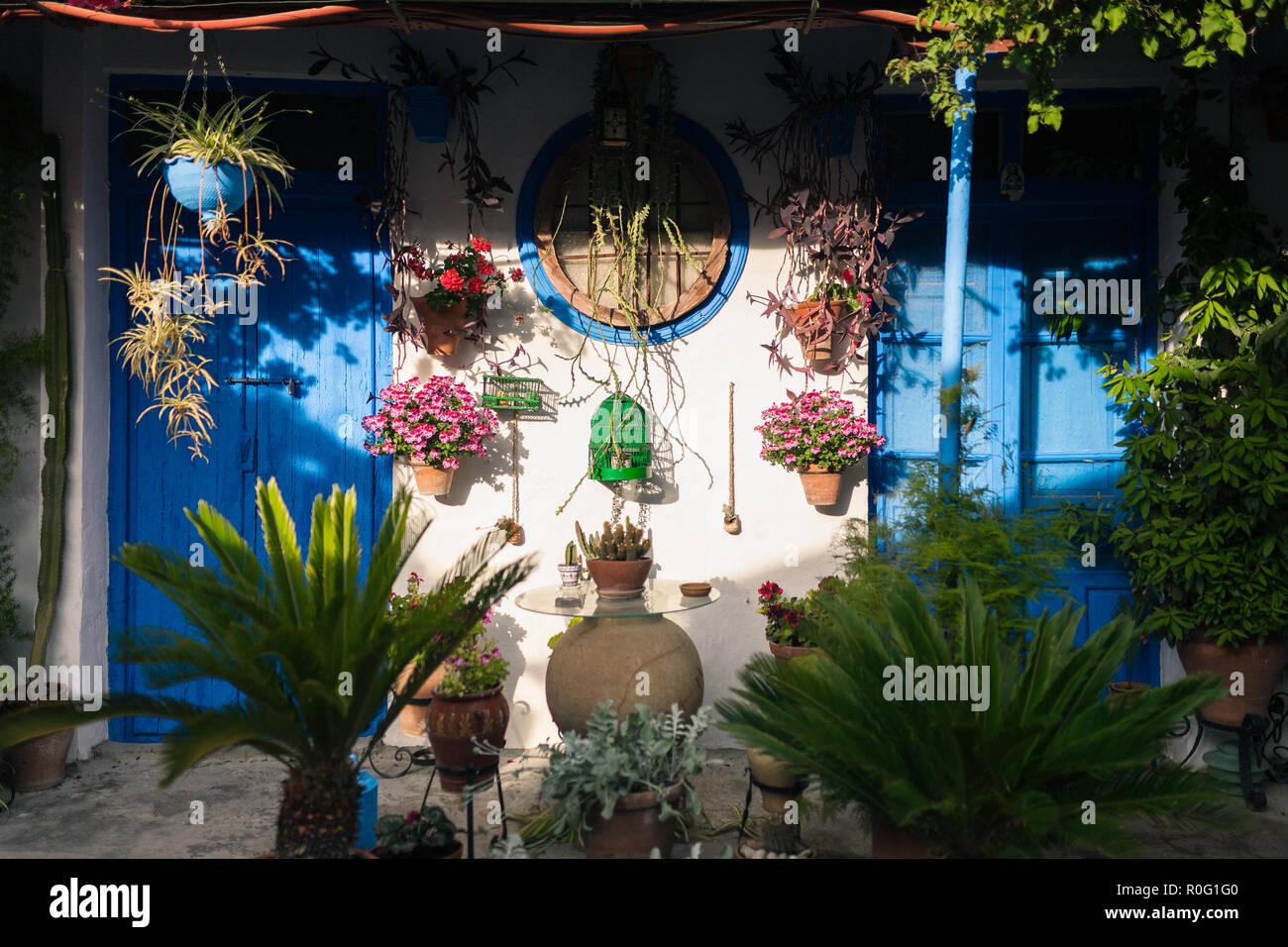 Typical andalusian courtyard in Cordoba, Andalusia Spain with blue ...