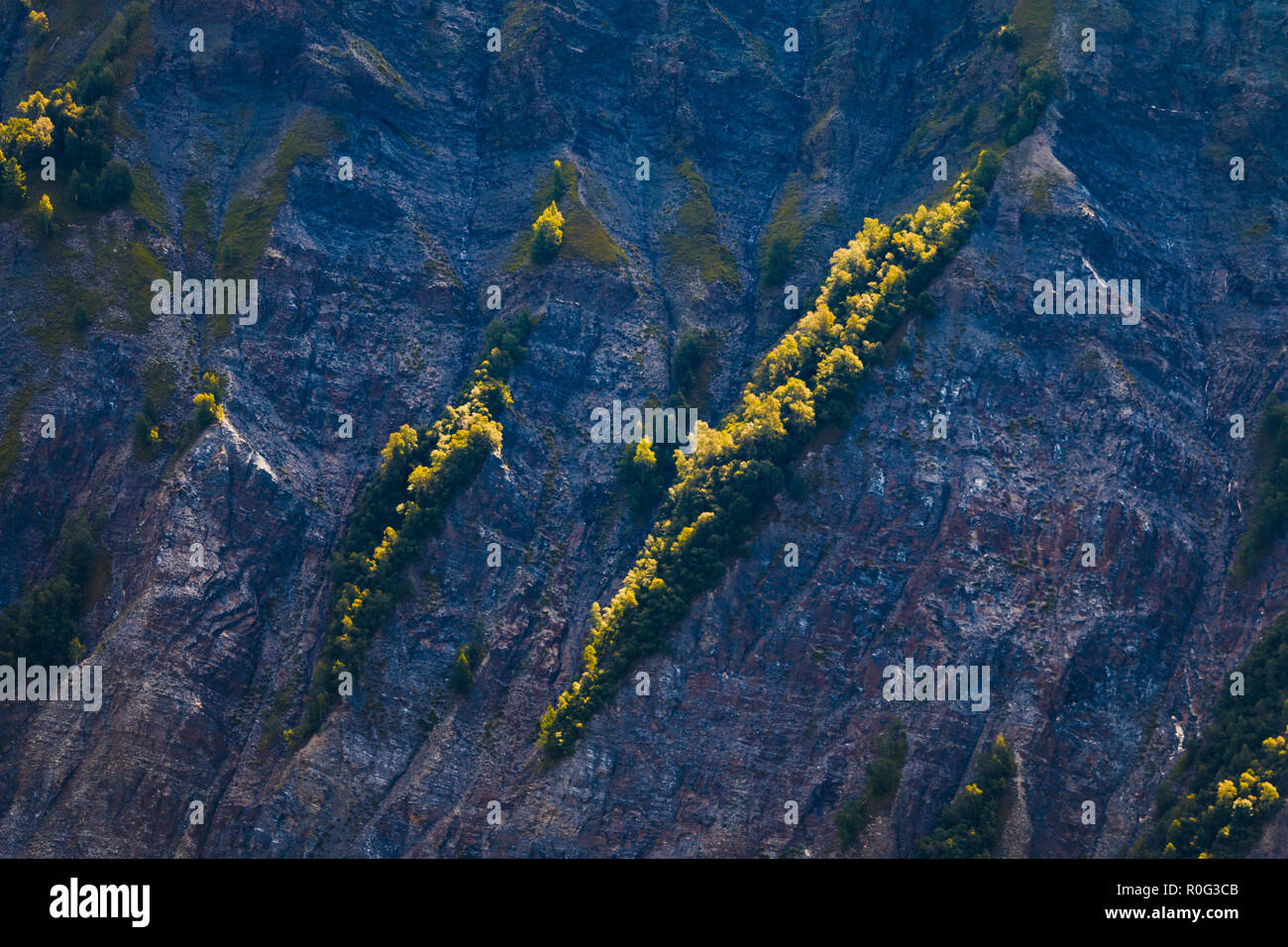 Steep cliff in french alps at summer time Stock Photo - Alamy