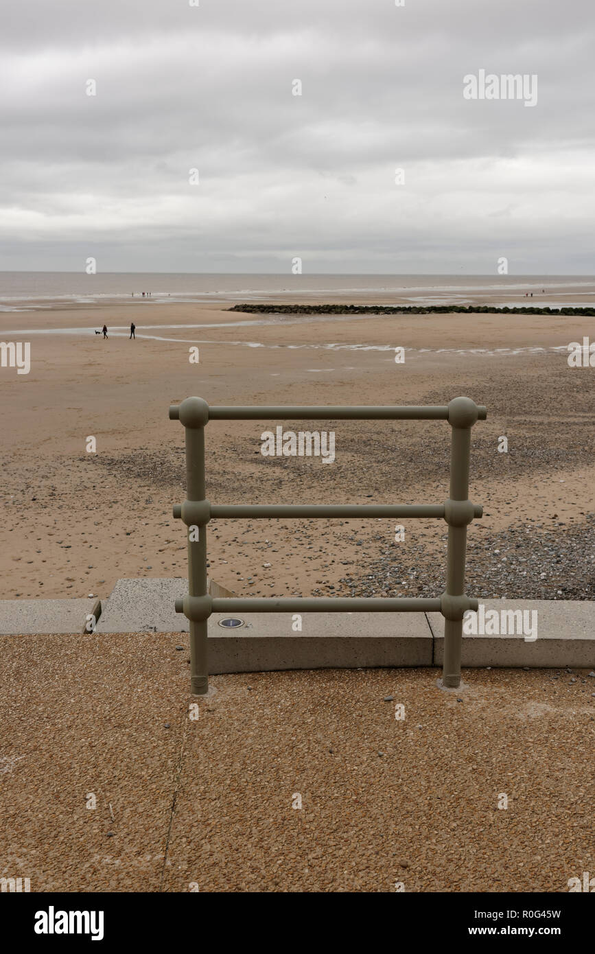 Safety fence on cleveleys promenade in overcast lighting on the fylde ...