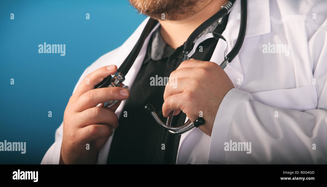 Male medicine therapeutist doctor hands holding stethoscope on his ...