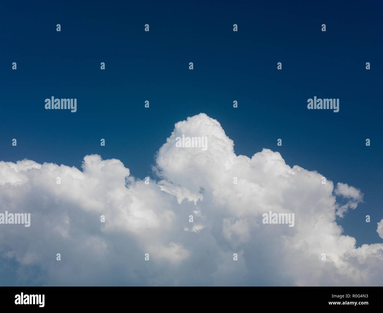 Cumulus clouds background texture Stock Photo - Alamy