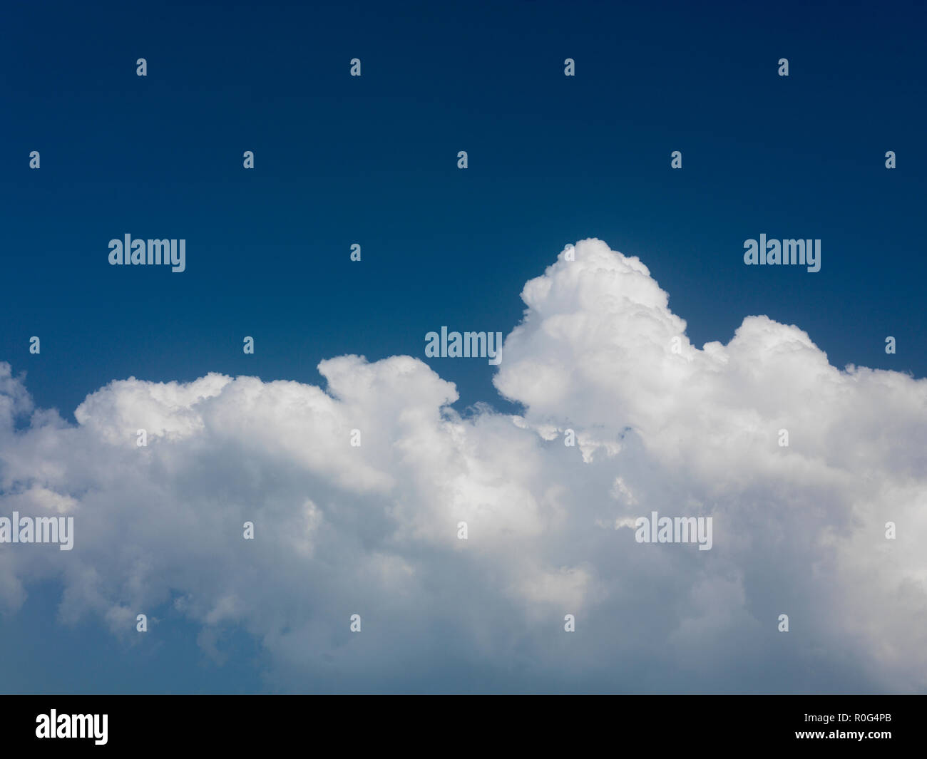 Cumulus clouds background texture Stock Photo - Alamy