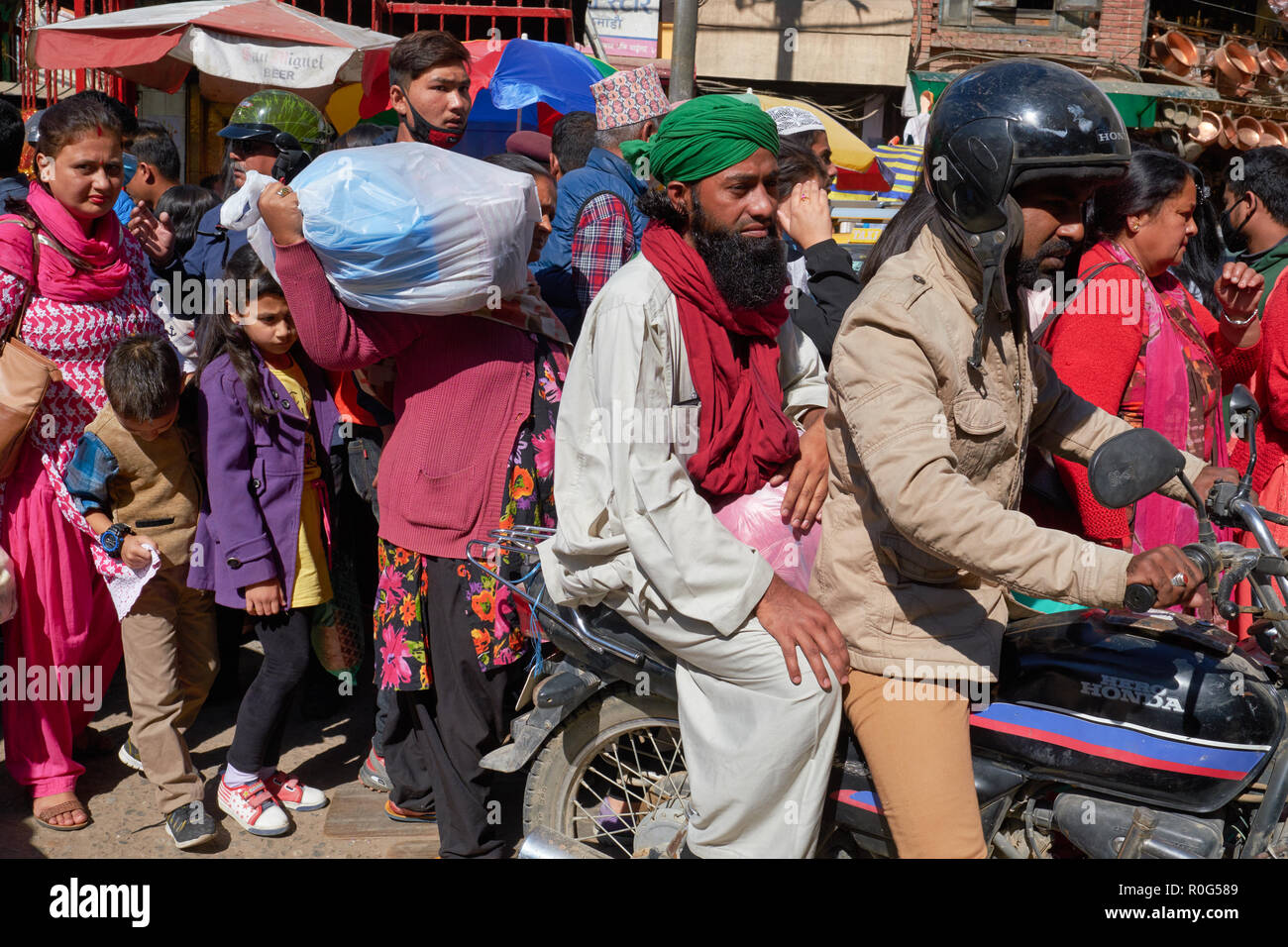A lane in a market area in Kathmandu, Nepal, is jam-packed with ...