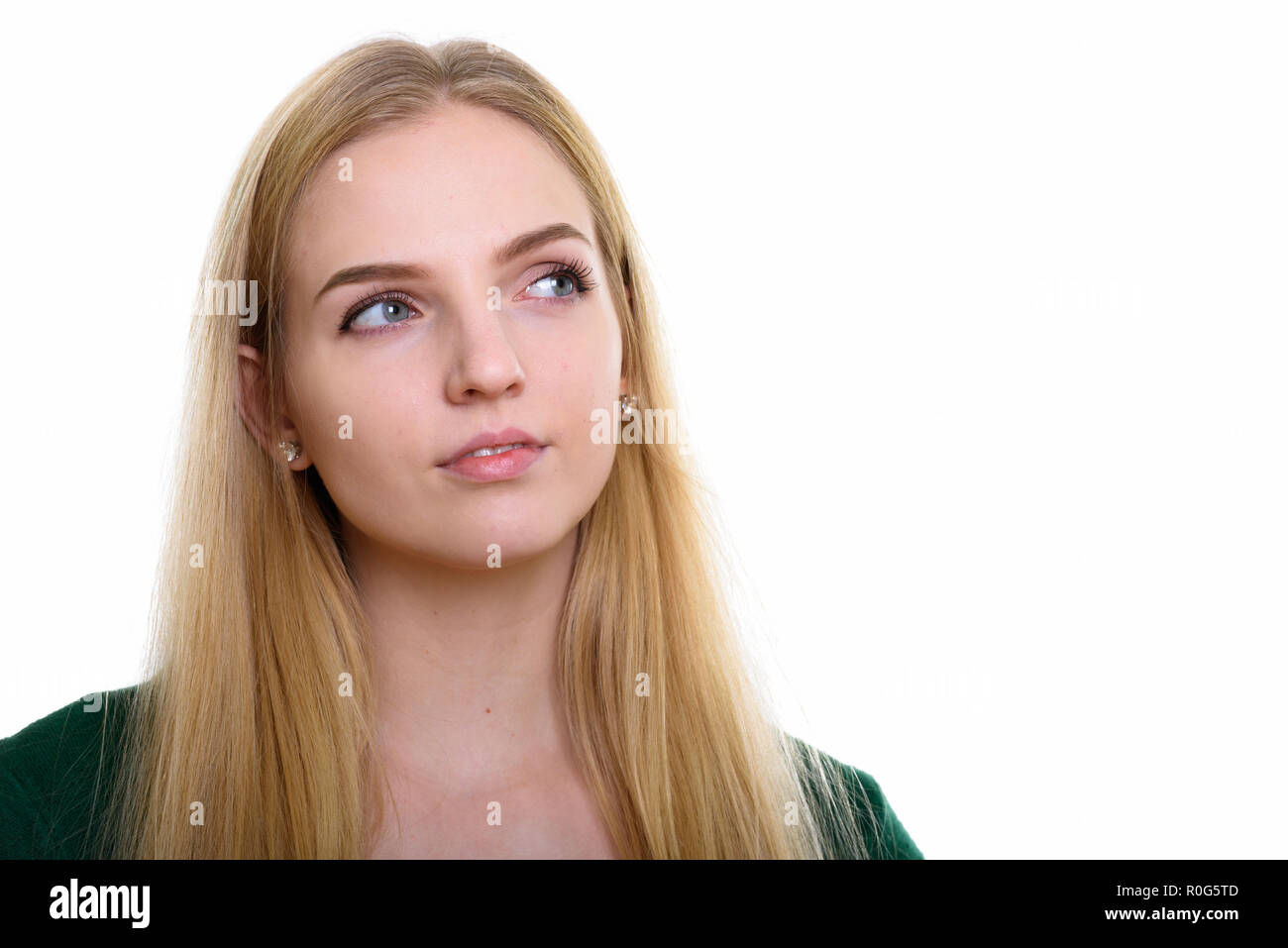 Close up of young beautiful teenage girl thinking Stock Photo - Alamy