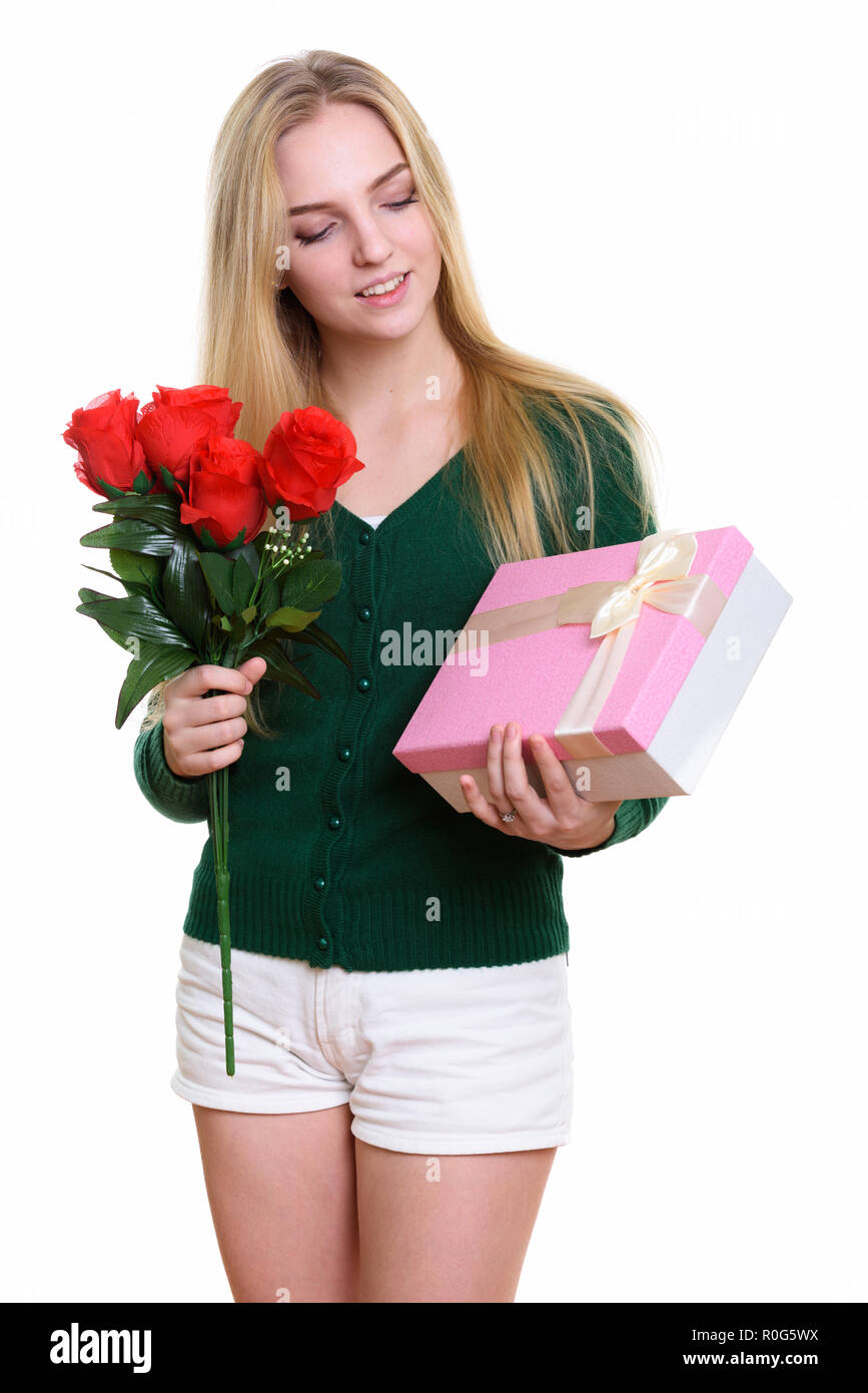Studio shot of young beautiful teenage girl holding red roses an Stock ...