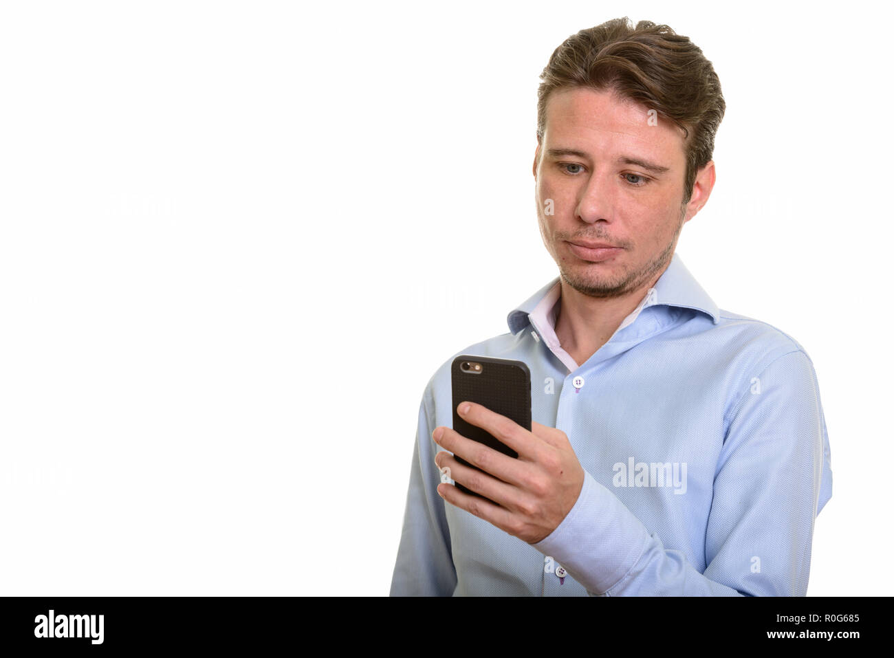 Businessman looking cell phone hi-res stock photography and images - Alamy