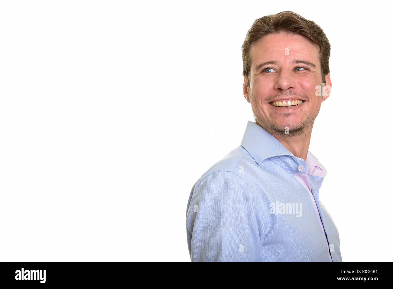 Man smiling over shoulder portrait hi-res stock photography and images ...