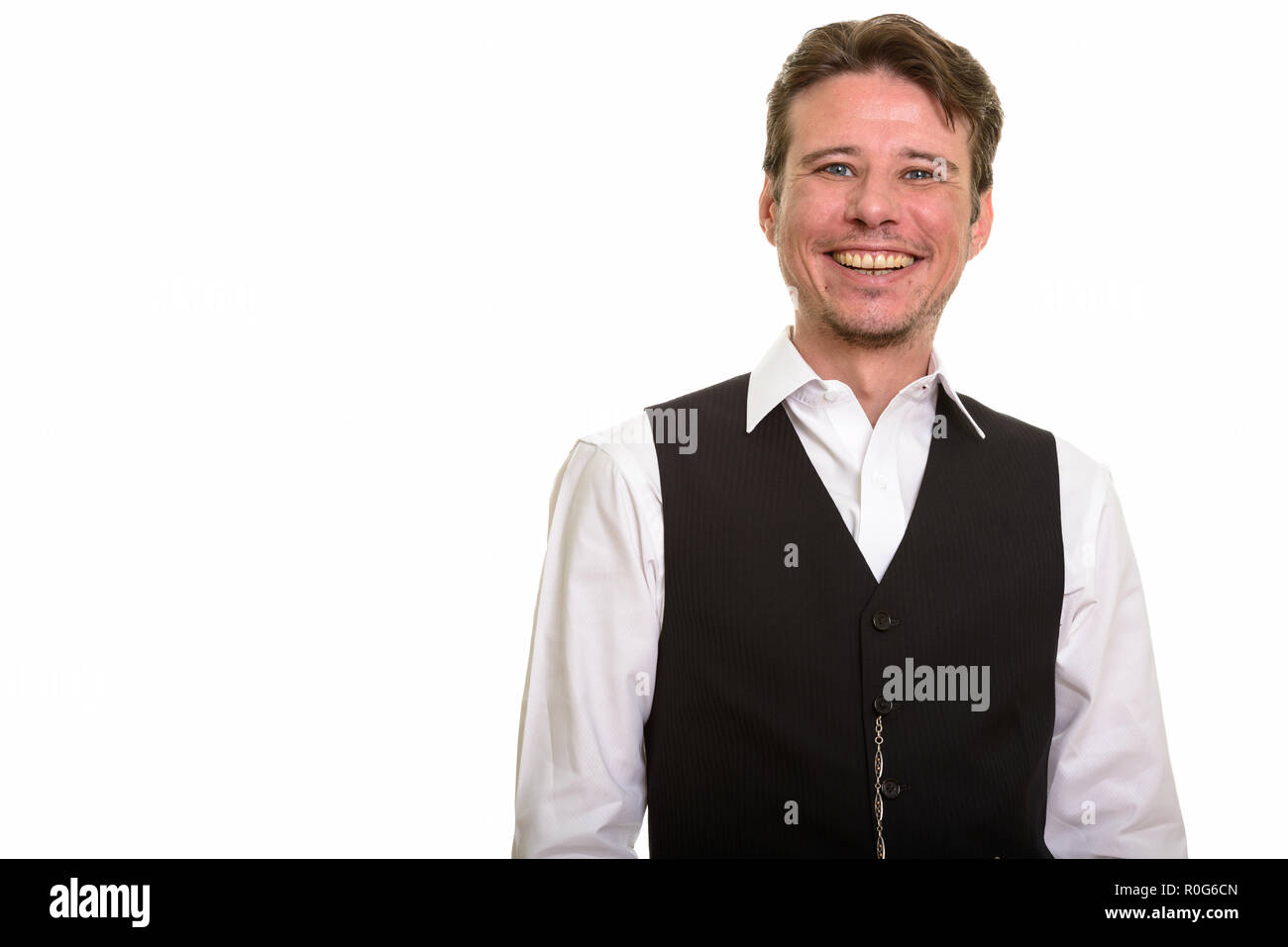 Happy formal Caucasian man smiling wearing vest Stock Photo - Alamy