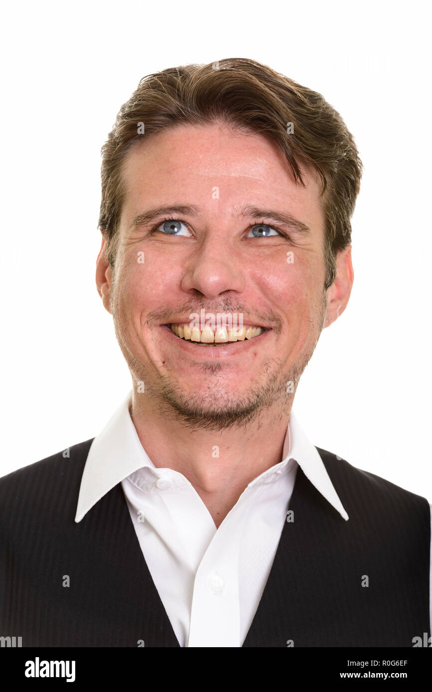 Happy formal Caucasian man thinking wearing vest Stock Photo - Alamy