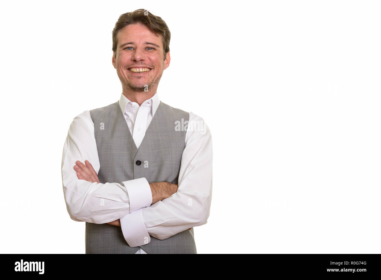 Happy formal Caucasian man smiling wearing vest Stock Photo - Alamy