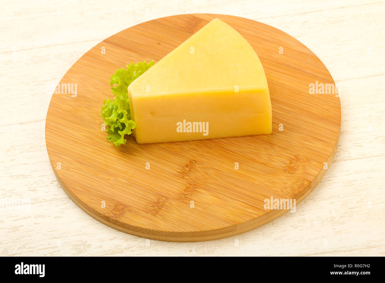 Parmesan cheese triangle Stock Photo - Alamy