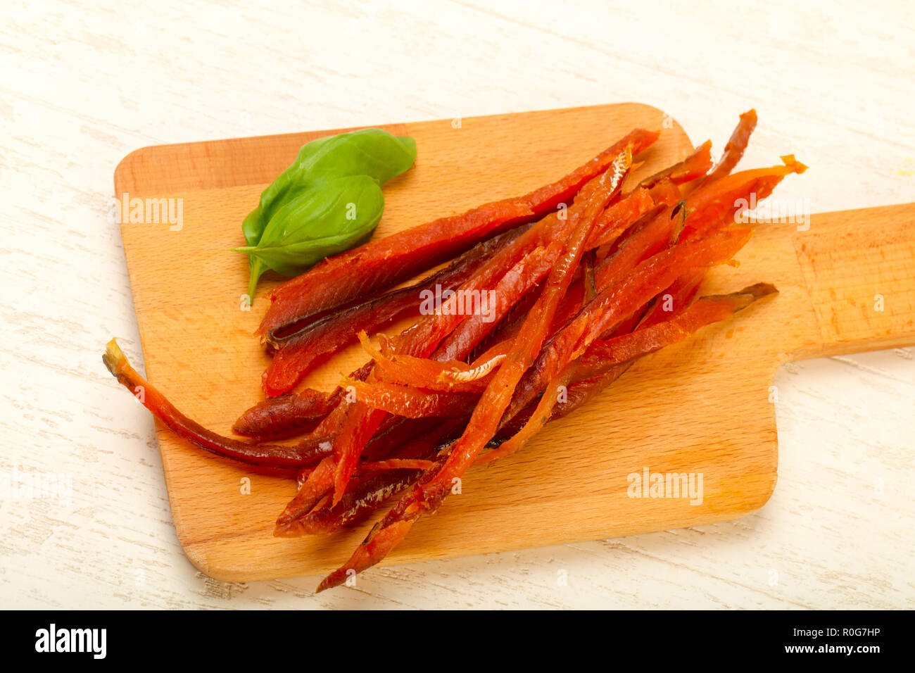 Salmon dry sticks snack Stock Photo - Alamy