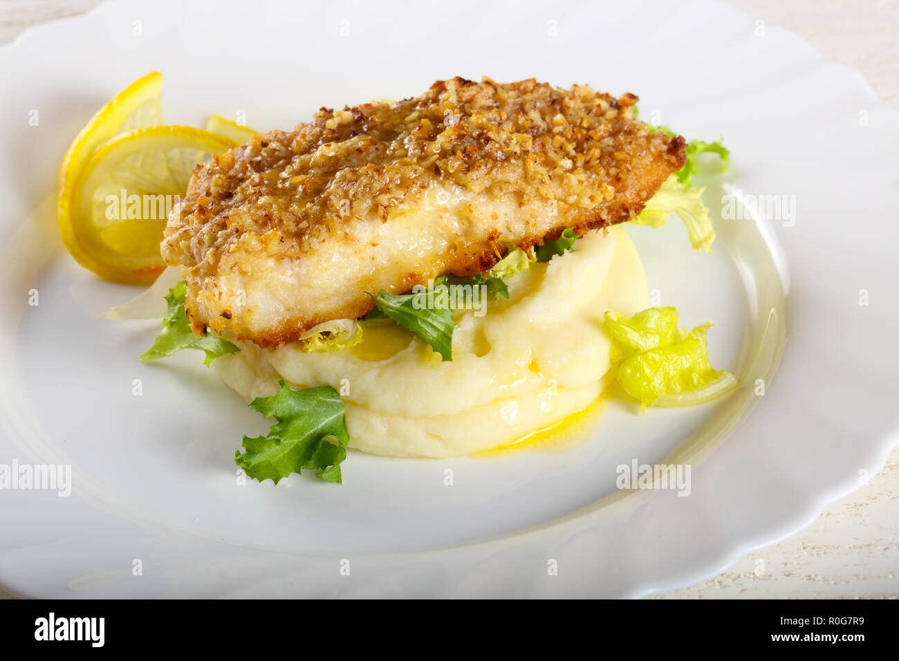 Baked Cod fish with mashed potato Stock Photo - Alamy