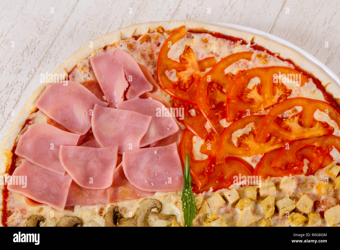 Pizza assortment mix with ham and mushrooms Stock Photo - Alamy