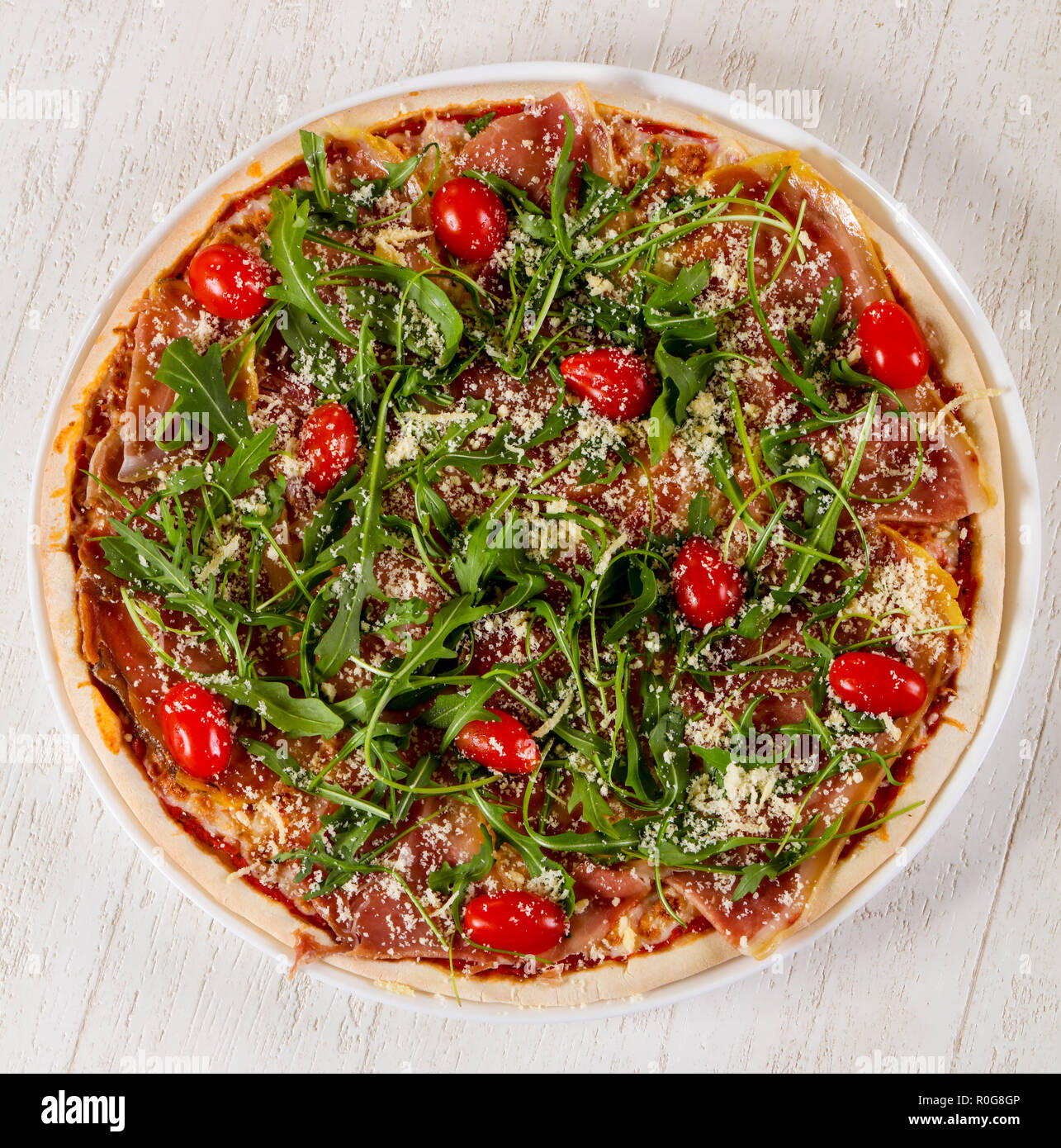 Pizza with hamon and ruccola Stock Photo - Alamy