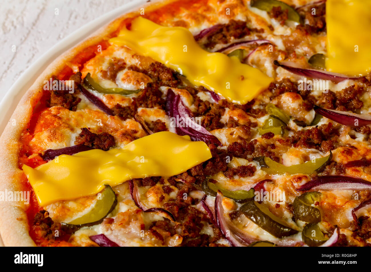 Pizza with minced meat and cheese Stock Photo - Alamy