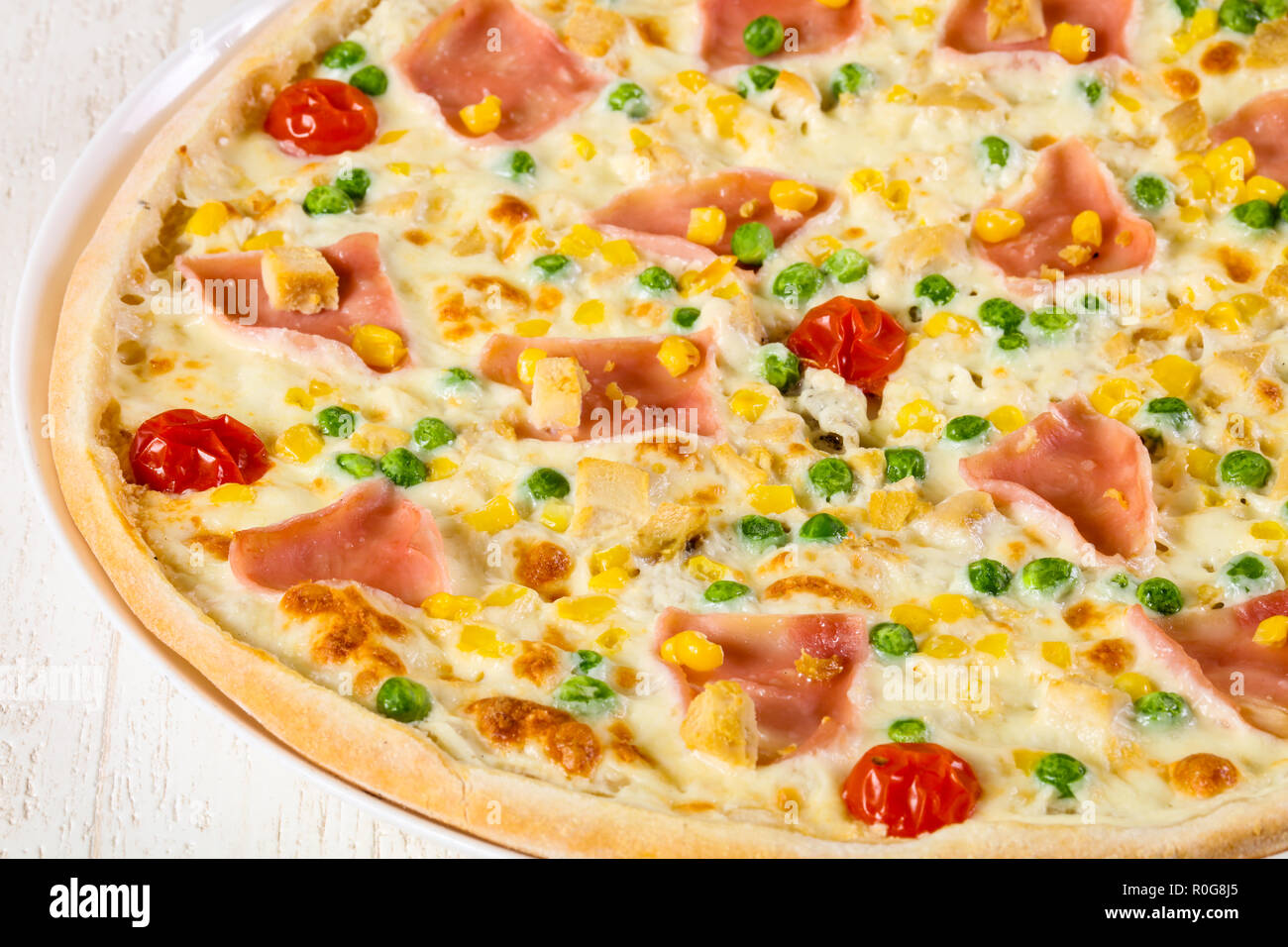 Pizza with ham and cheese Stock Photo - Alamy