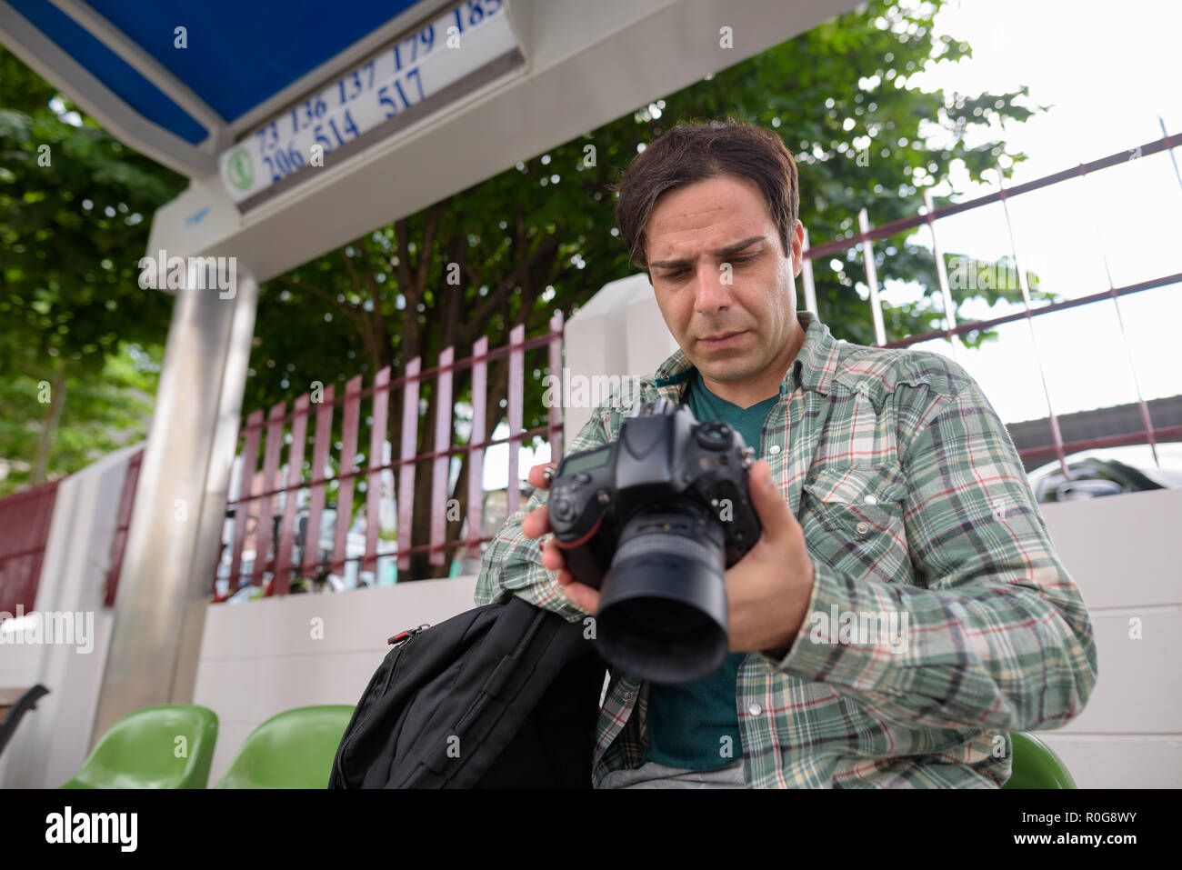 Tourist photographer man exploring the city of Bangkok Stock Photo - Alamy