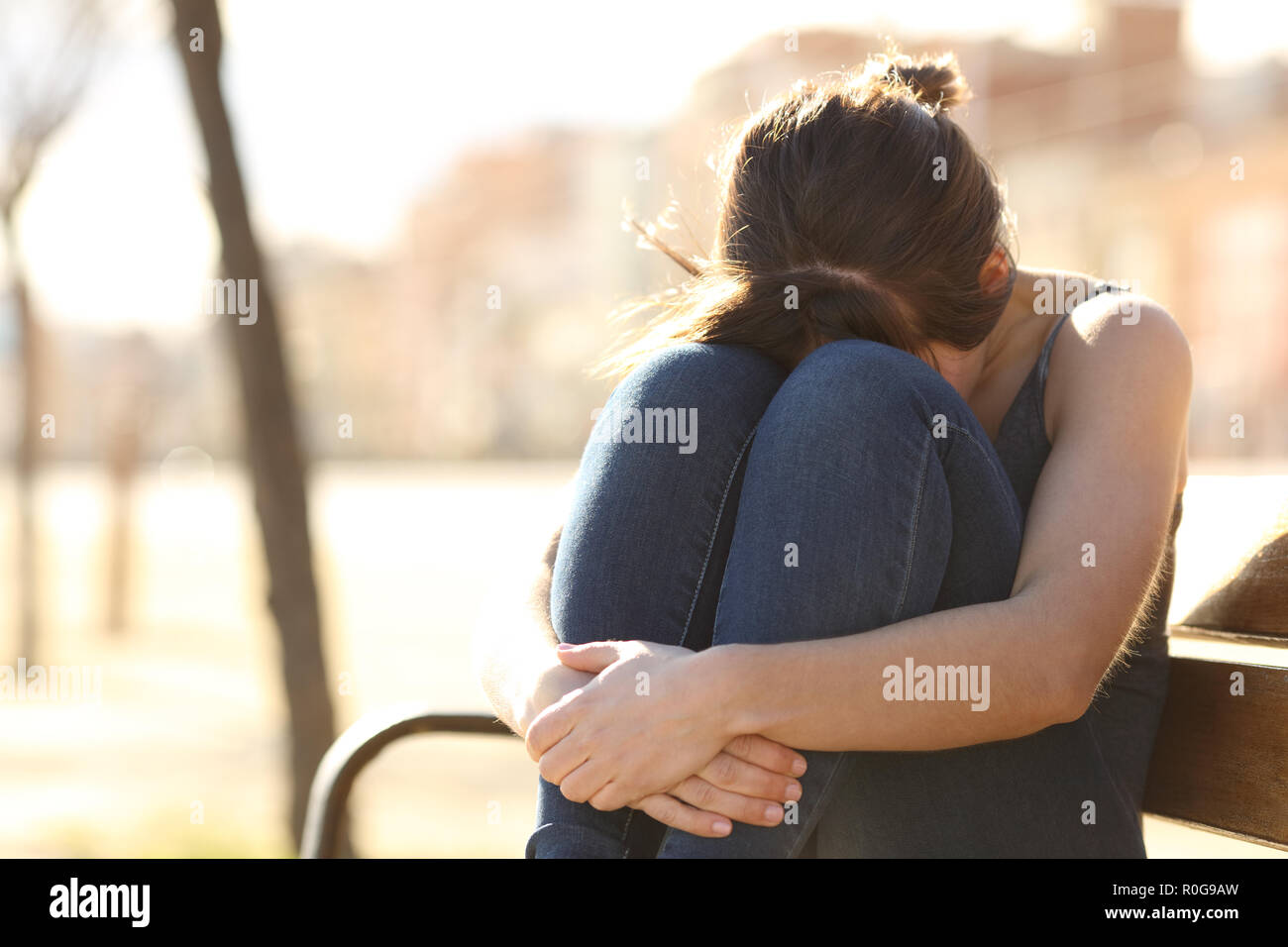 Depressed Teenager Hiding Face Stock Photos & Depressed Teenager Hiding ...