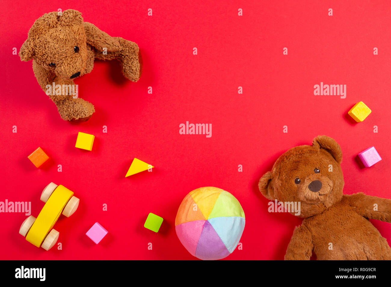 Baby kids toys background. Teddy bear, wooden car, colorful bricks on ...