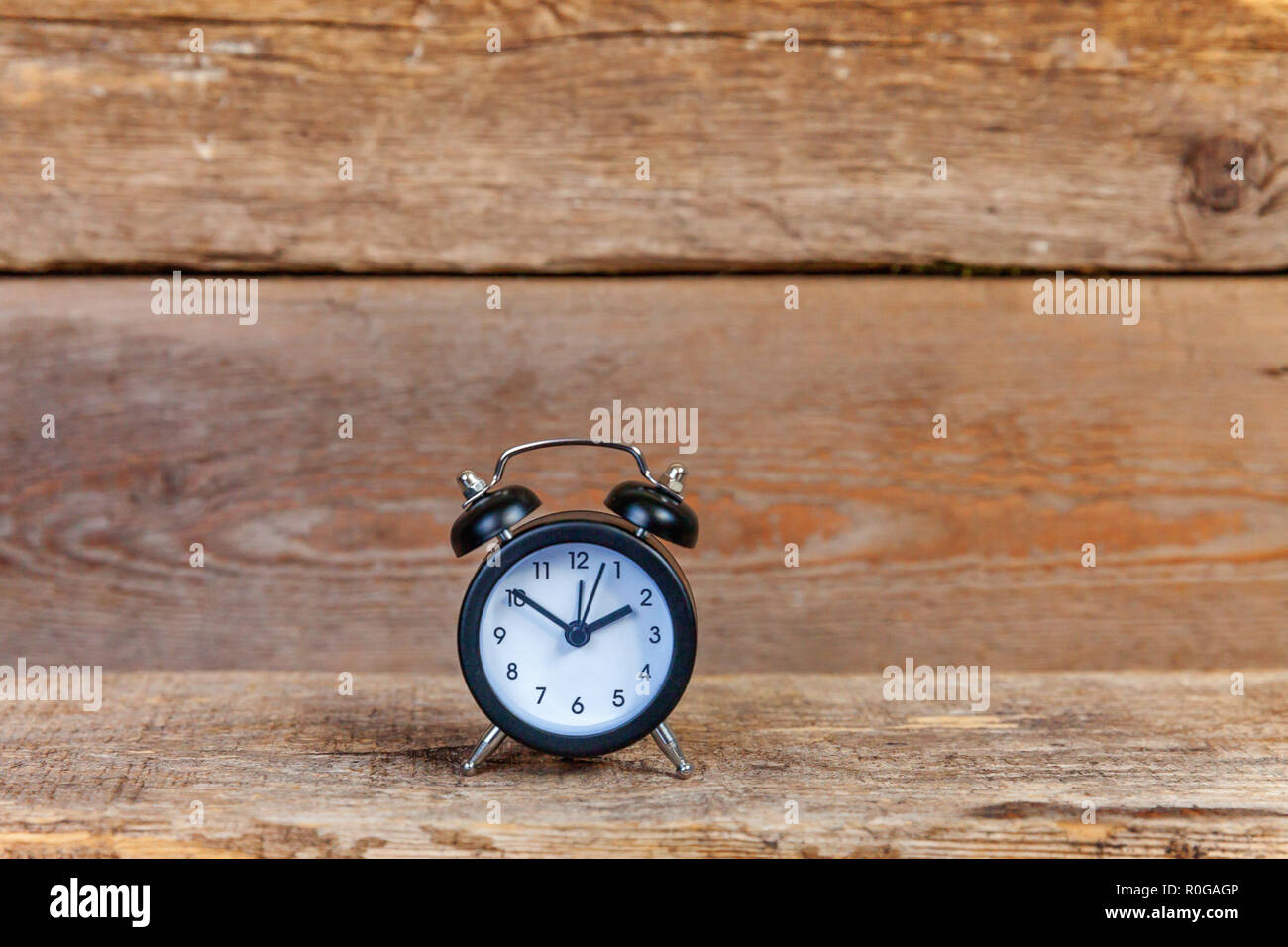 Ringing twin bell vintage classic alarm clock on old shabby rustic ...