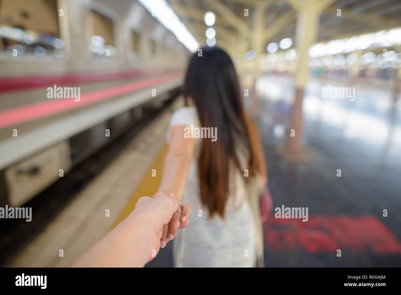 Couple holding hand rear view in love hi-res stock photography and ...