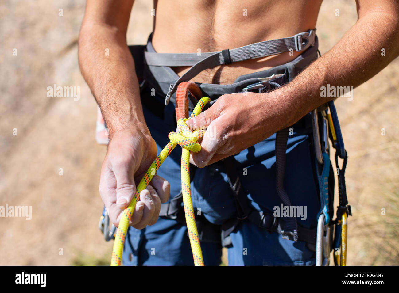 Close up of climber making a knot called double eight with the rope in ...