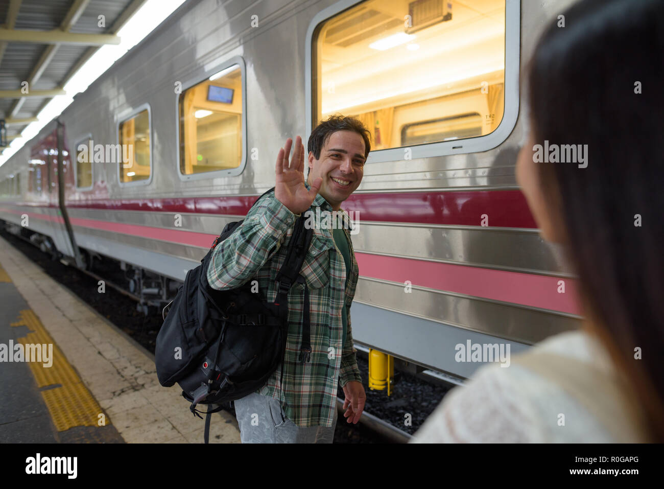 Asian man greeting beautiful woman hi-res stock photography and images ...